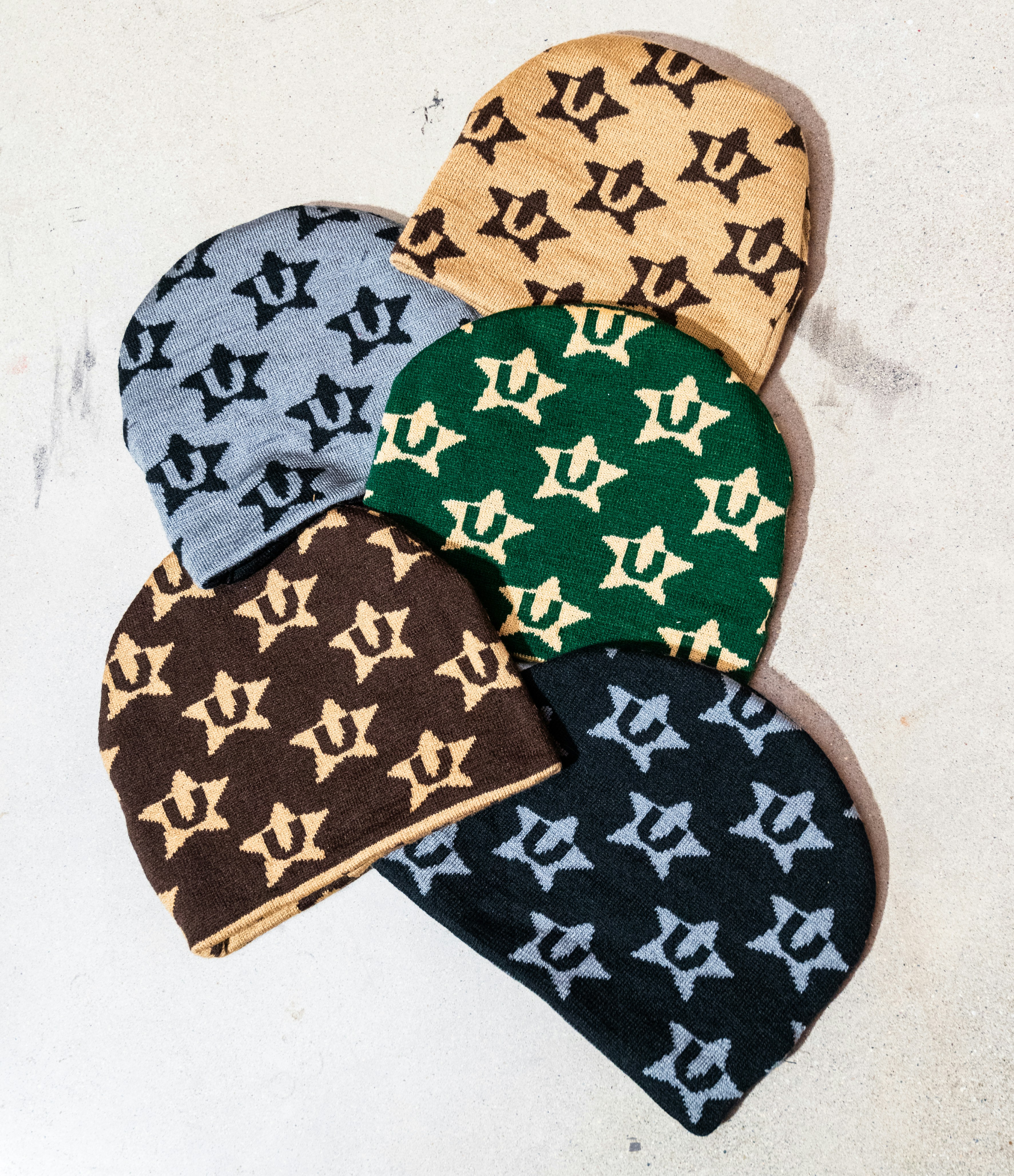 Monogram Mosaic: Five Knit Caps Arranged in a Colorful Loop