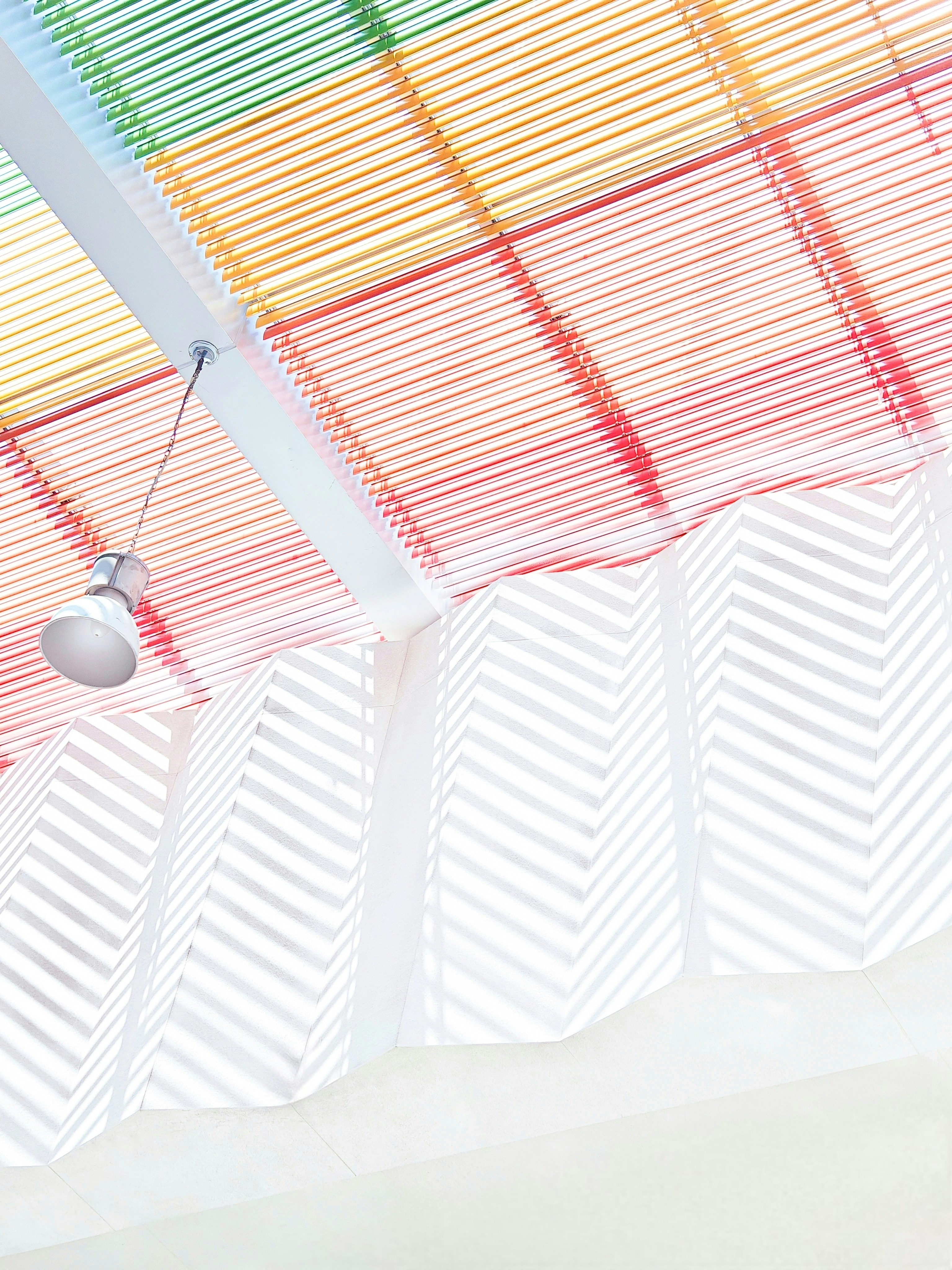 A room with a ceiling fan and a rainbow colored ceiling photo – Free ...