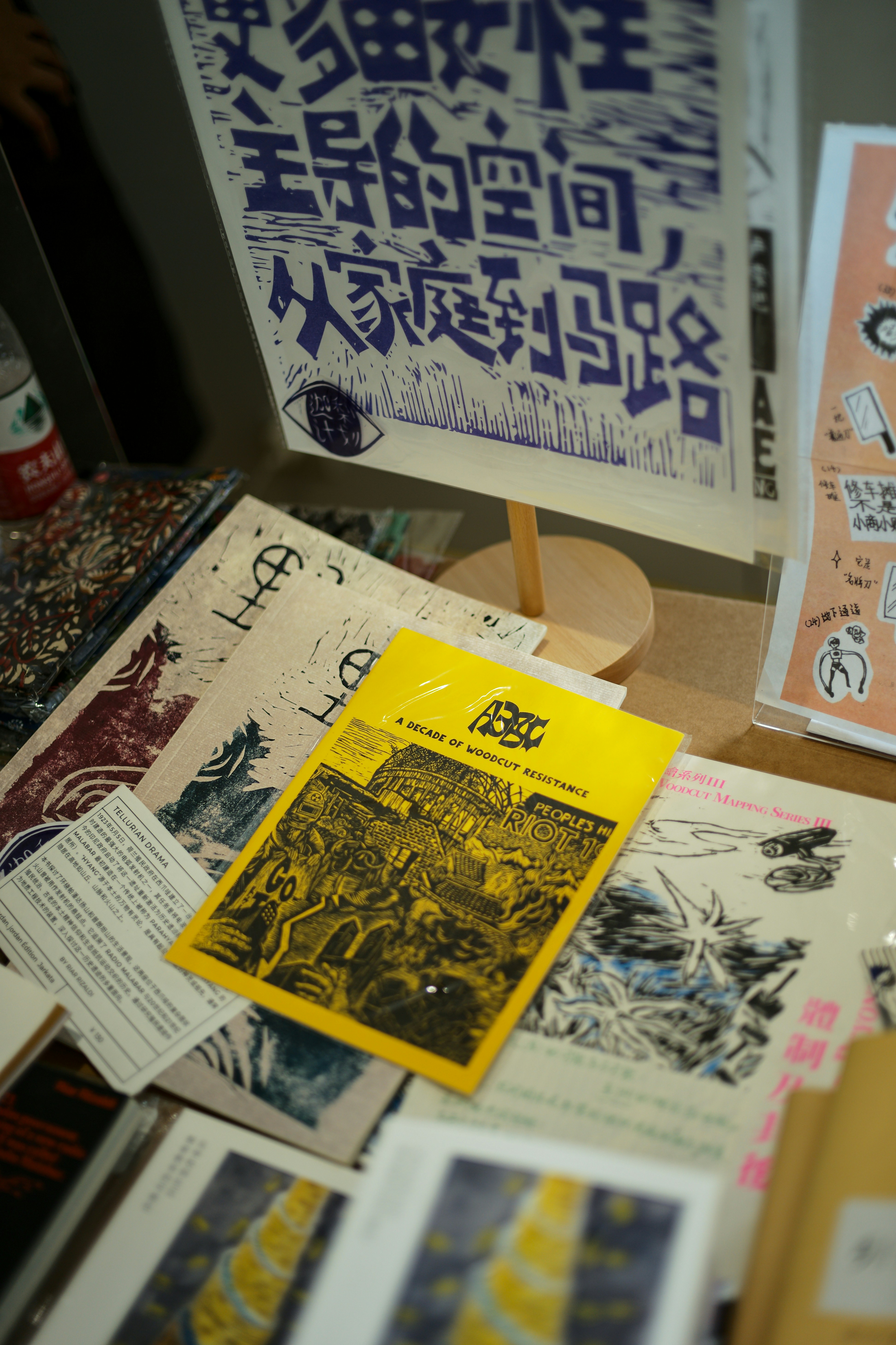 A table topped with lots of different types of posters photo – Free ...