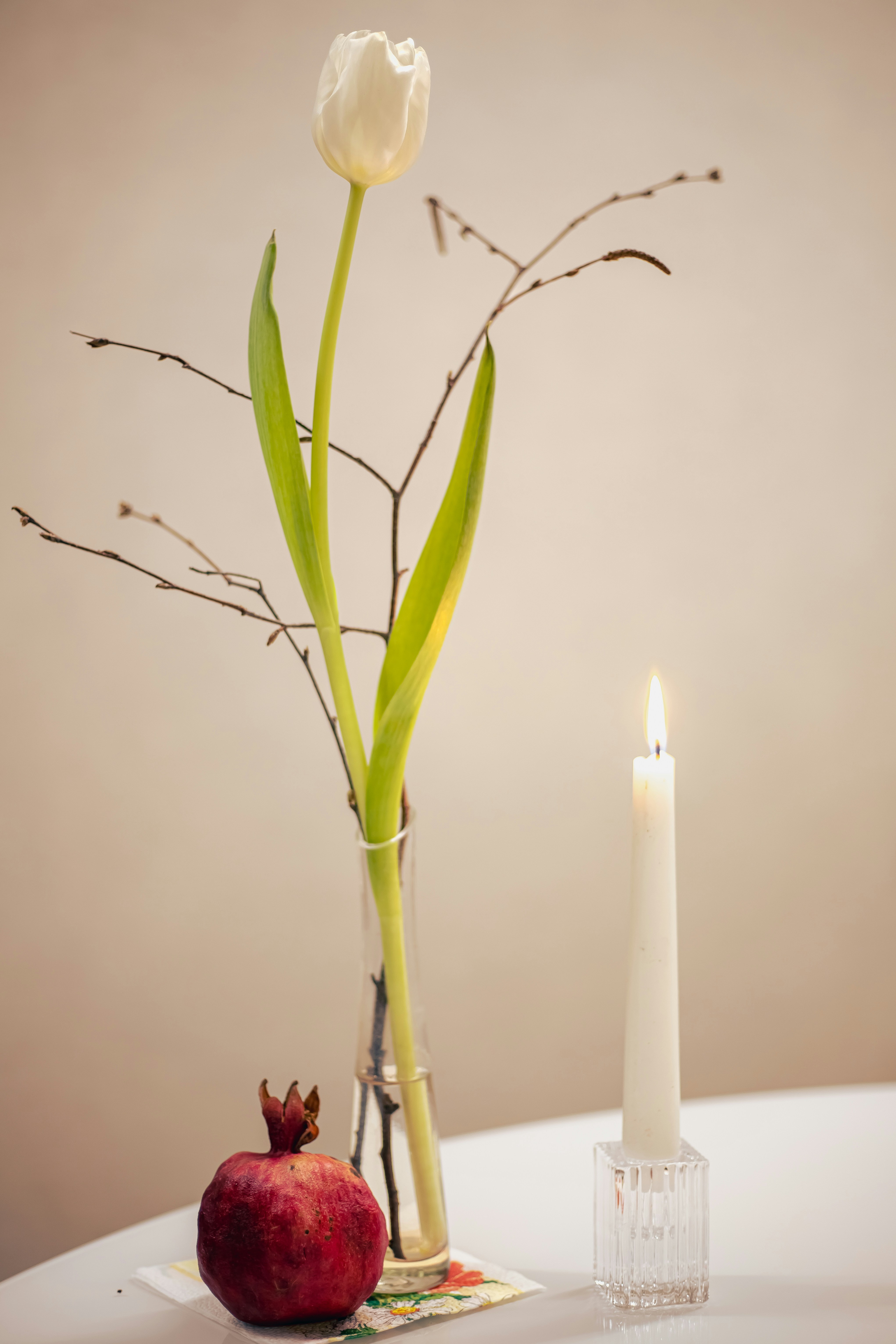 Soft Reverie: A Minimal Still-Life of Tulip, Candle, and Pomegranate