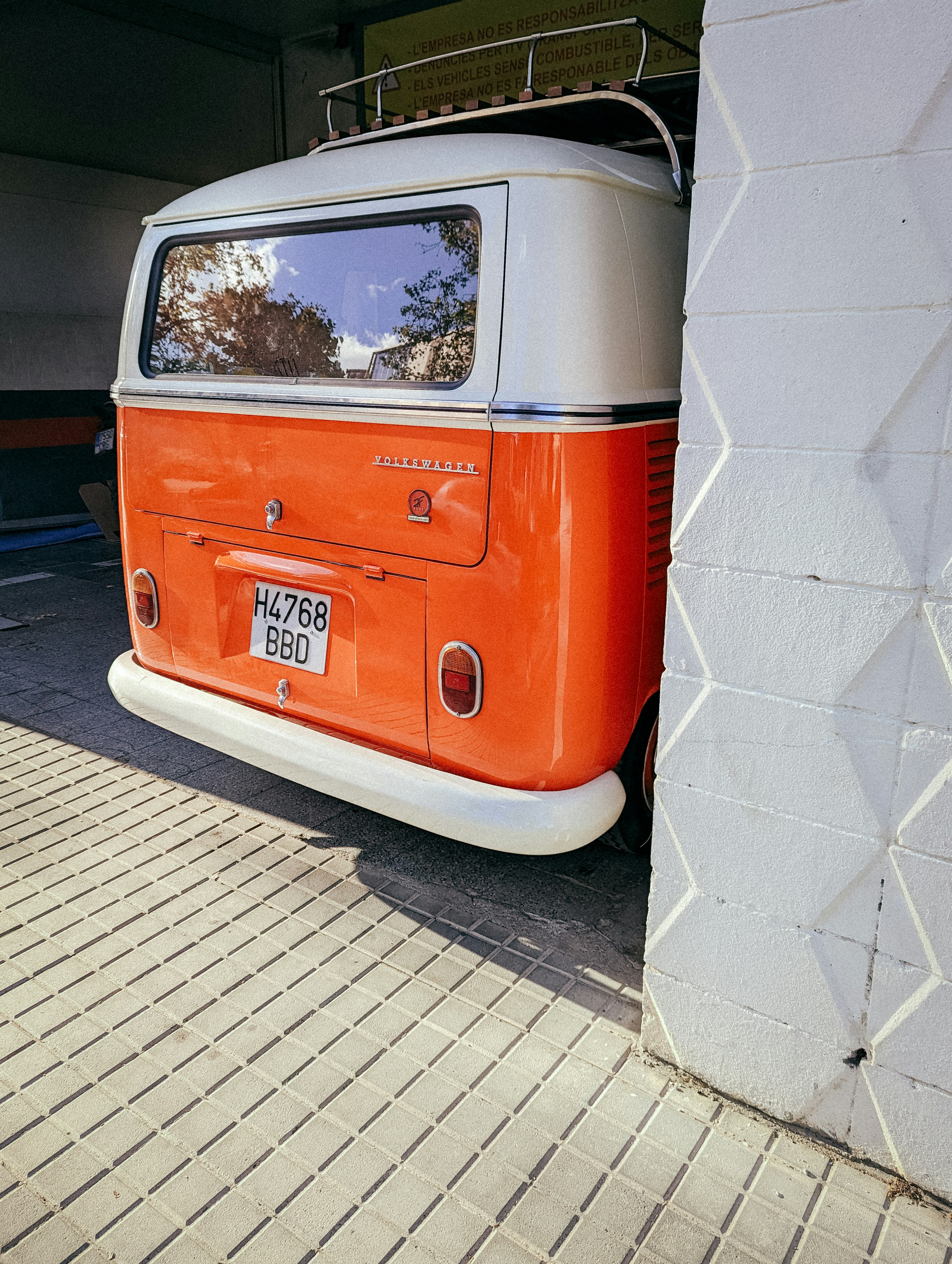 Retro Orange VW Camper Hunkered in a Quiet Garage