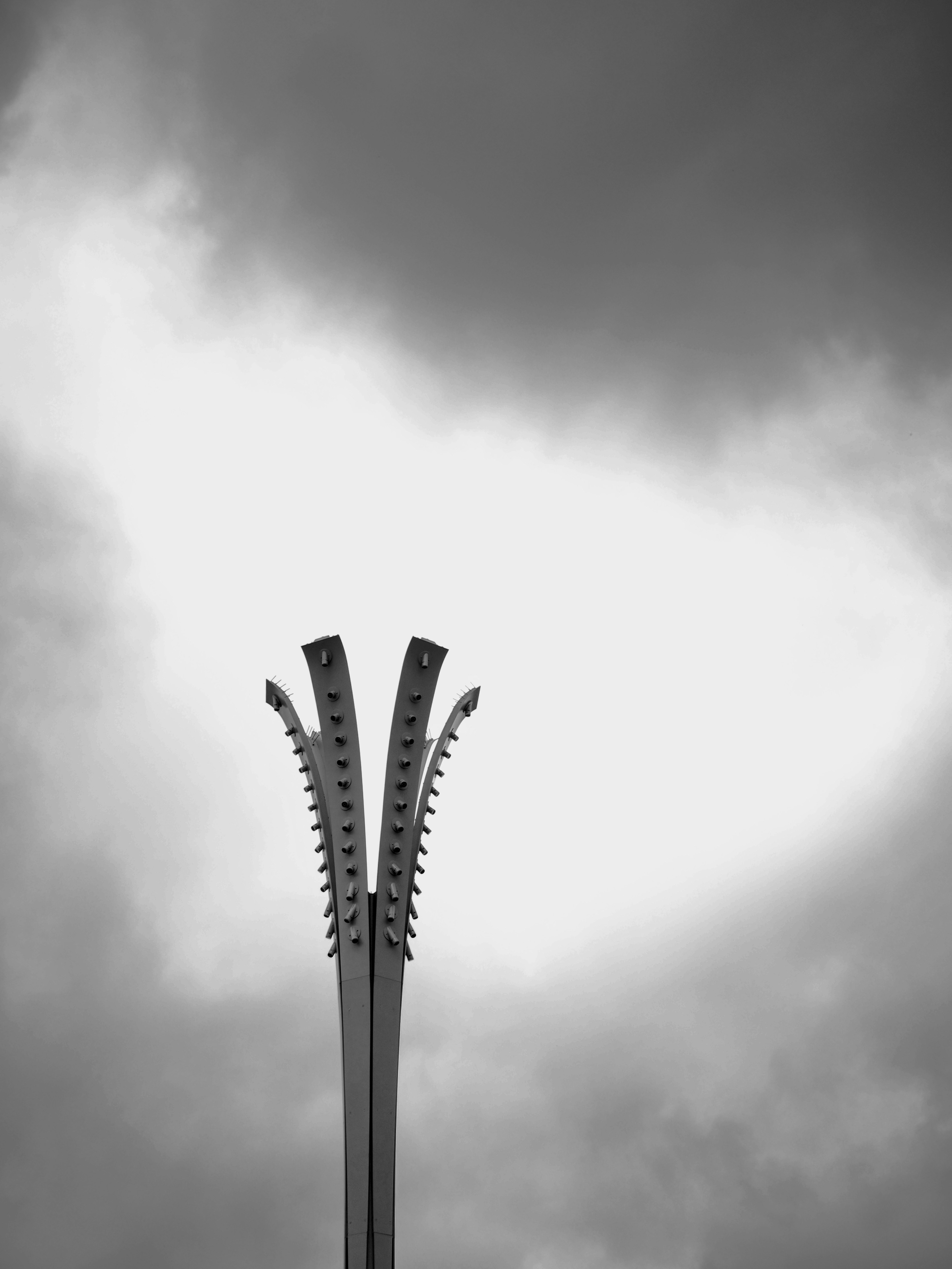 Three-Arm Steel Spire Against a Brooding Sky