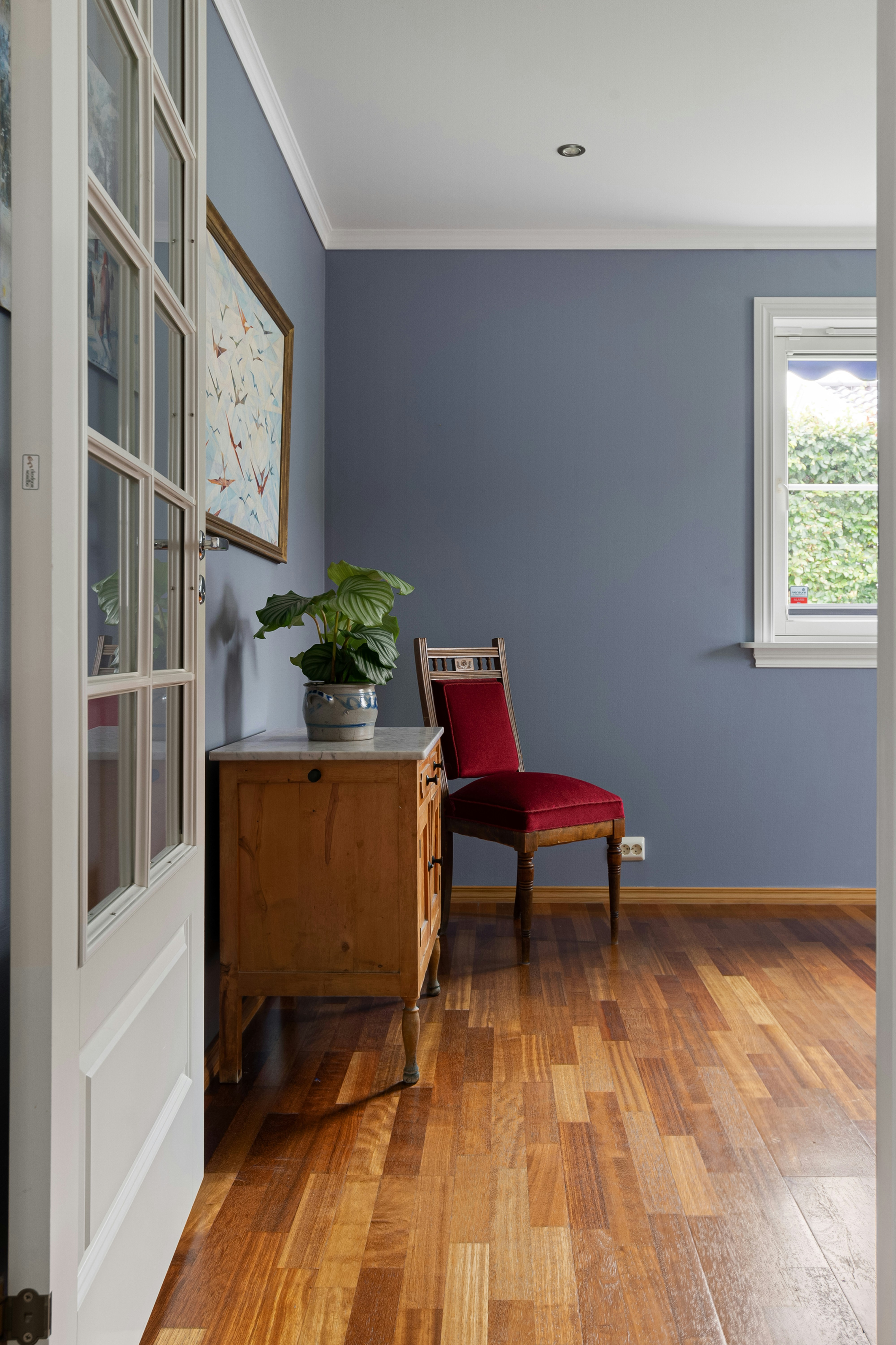 A room with blue walls and wooden floors photo – Free Floor Image on ...
