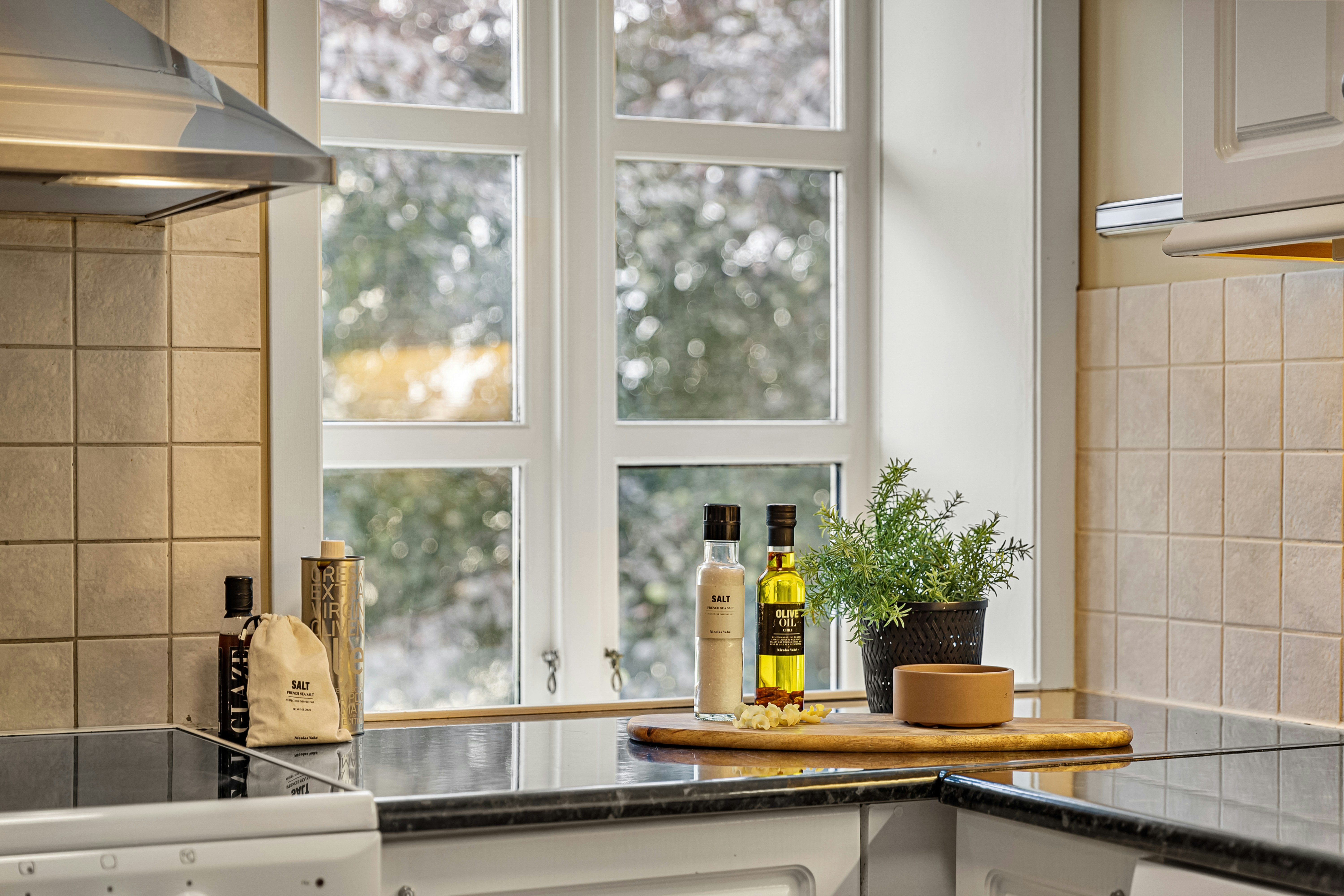 A kitchen with a stove top oven next to a window photo – Free Window ...
