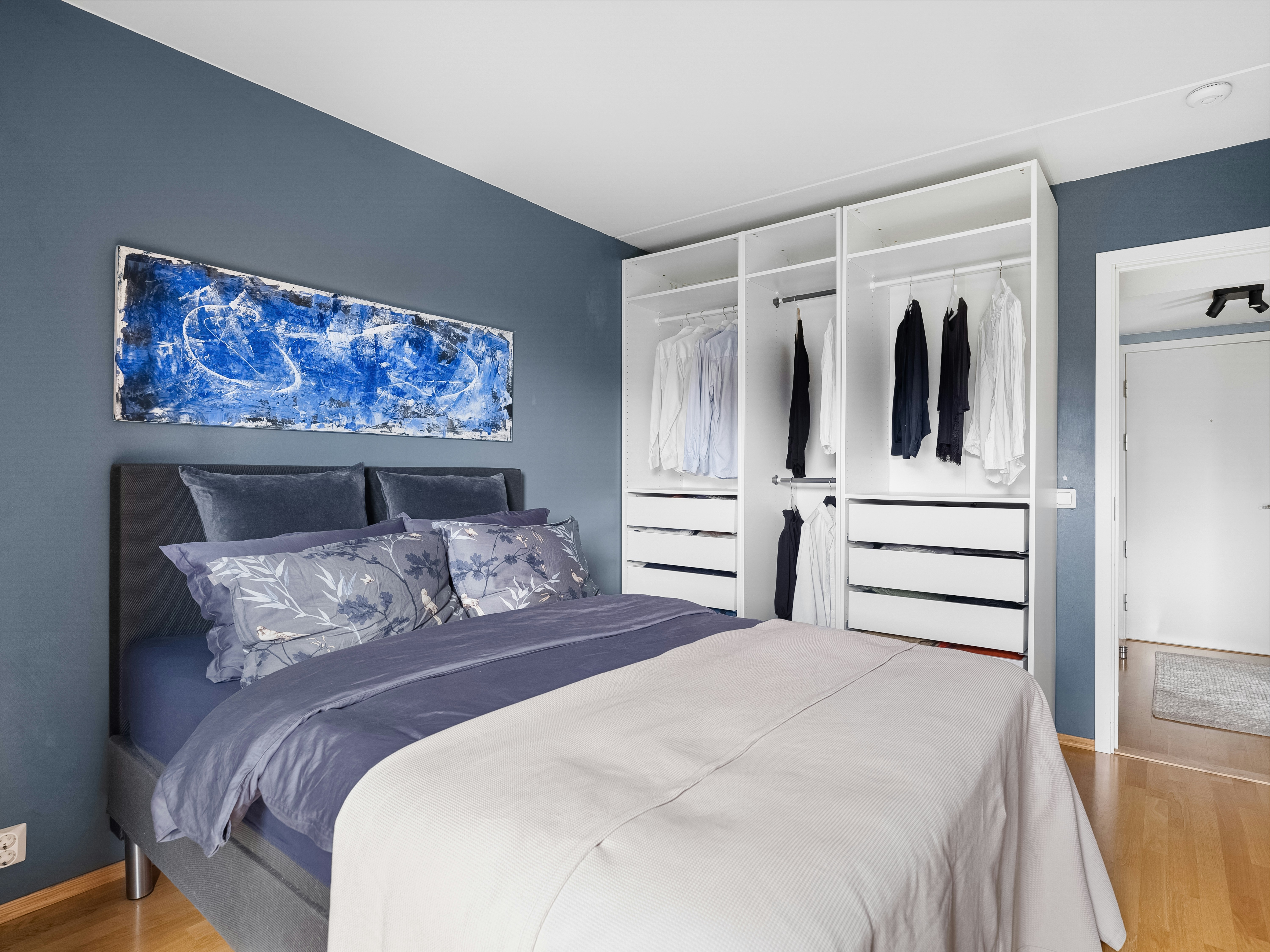 A bedroom with blue walls and a white bed photo – Free Indoors Image on ...