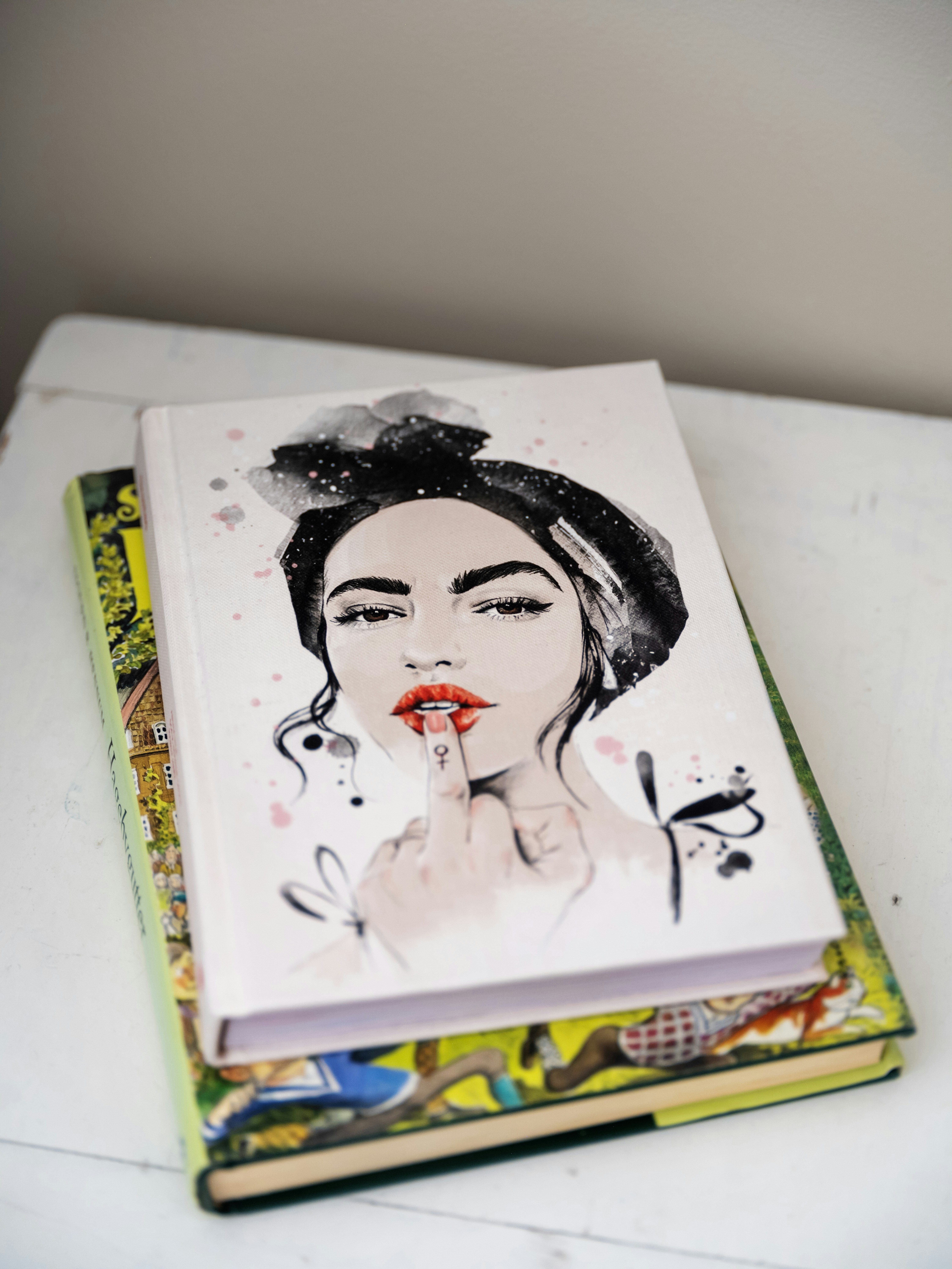 A book with a picture of a woman's face on it photo – Free Woman Image ...