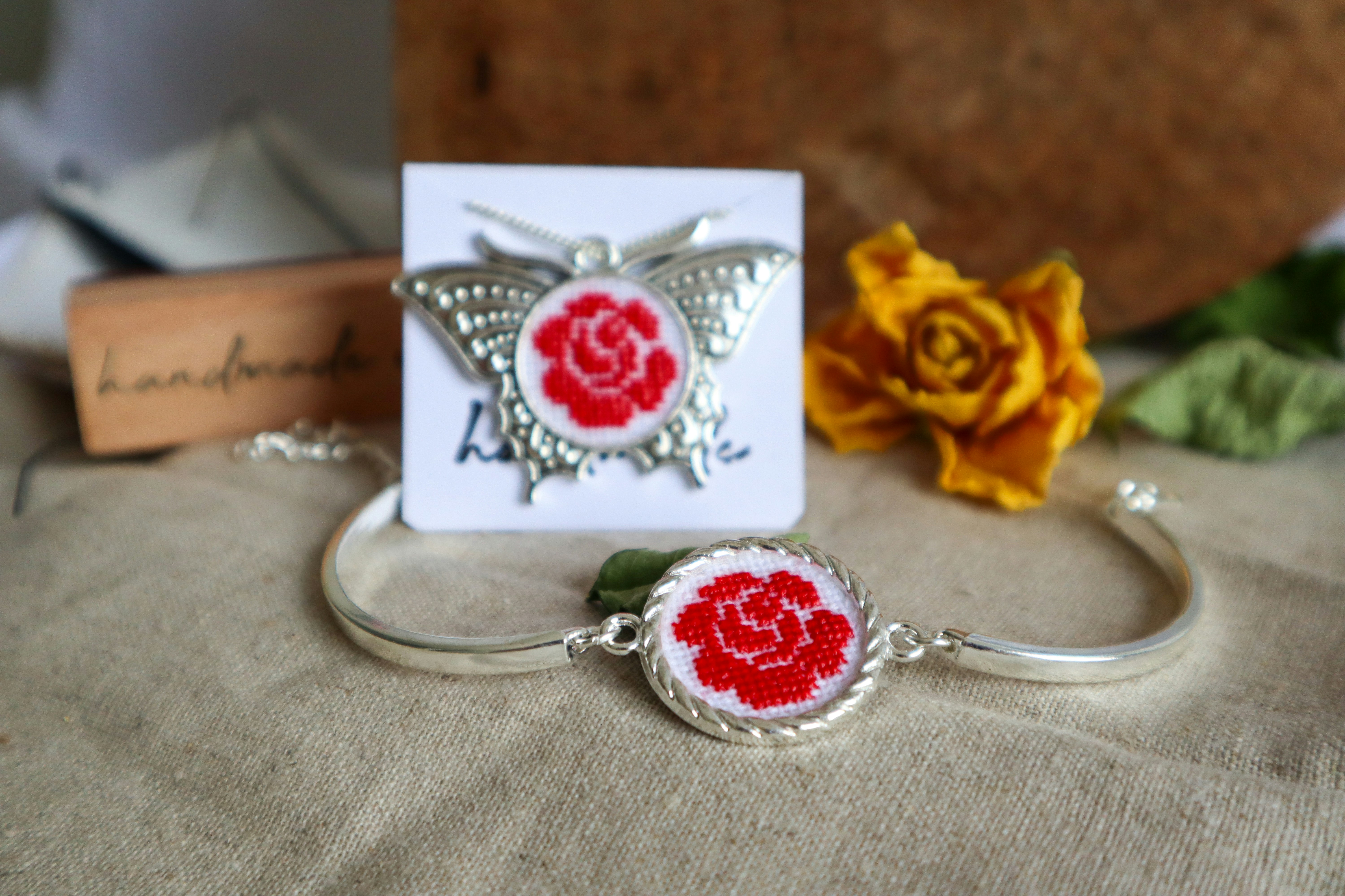 Rosy Medallion on Silver Bracelet Framed by a Butterfly Card