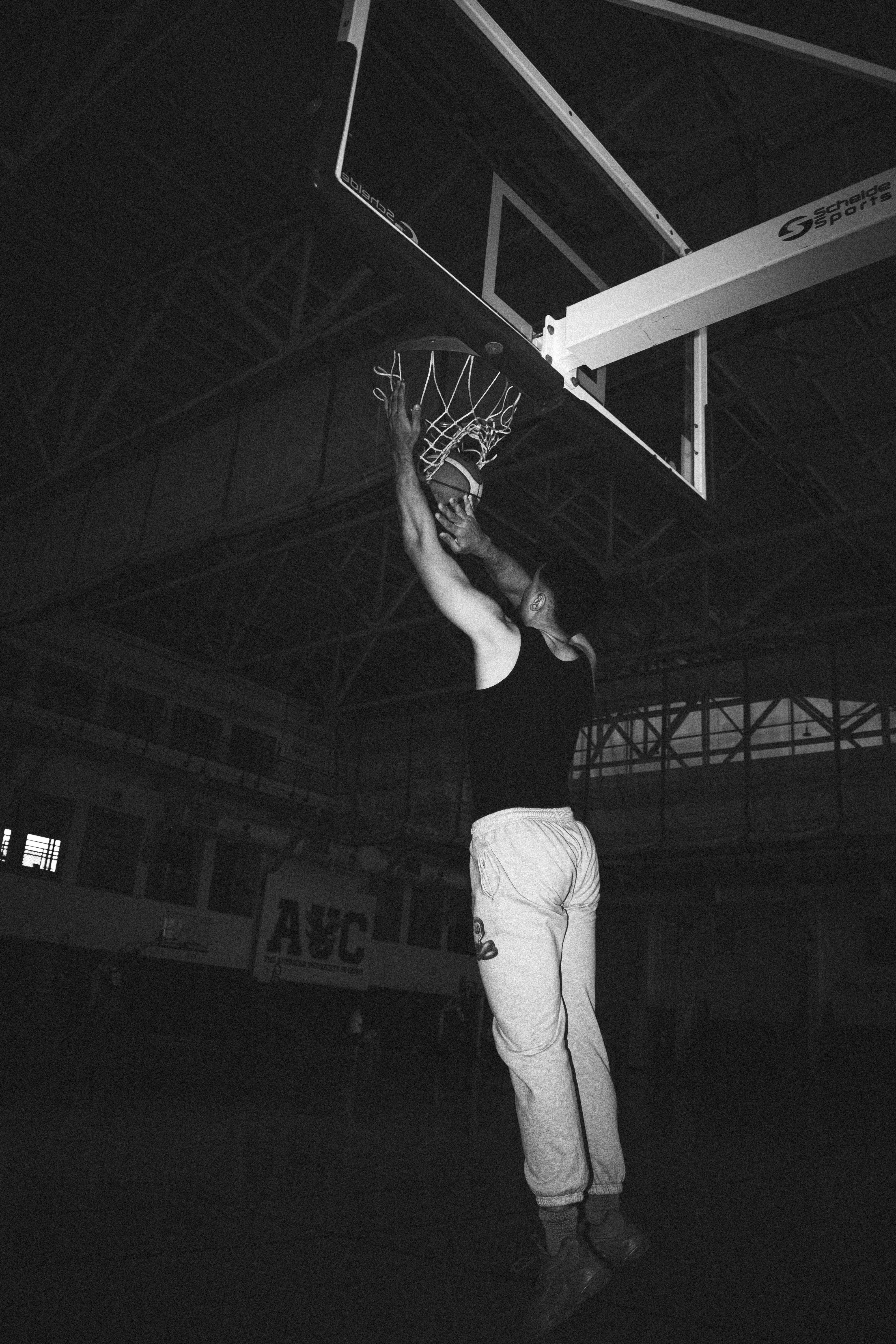 A man dunking a basketball into the hoop photo – Free Human Image on ...