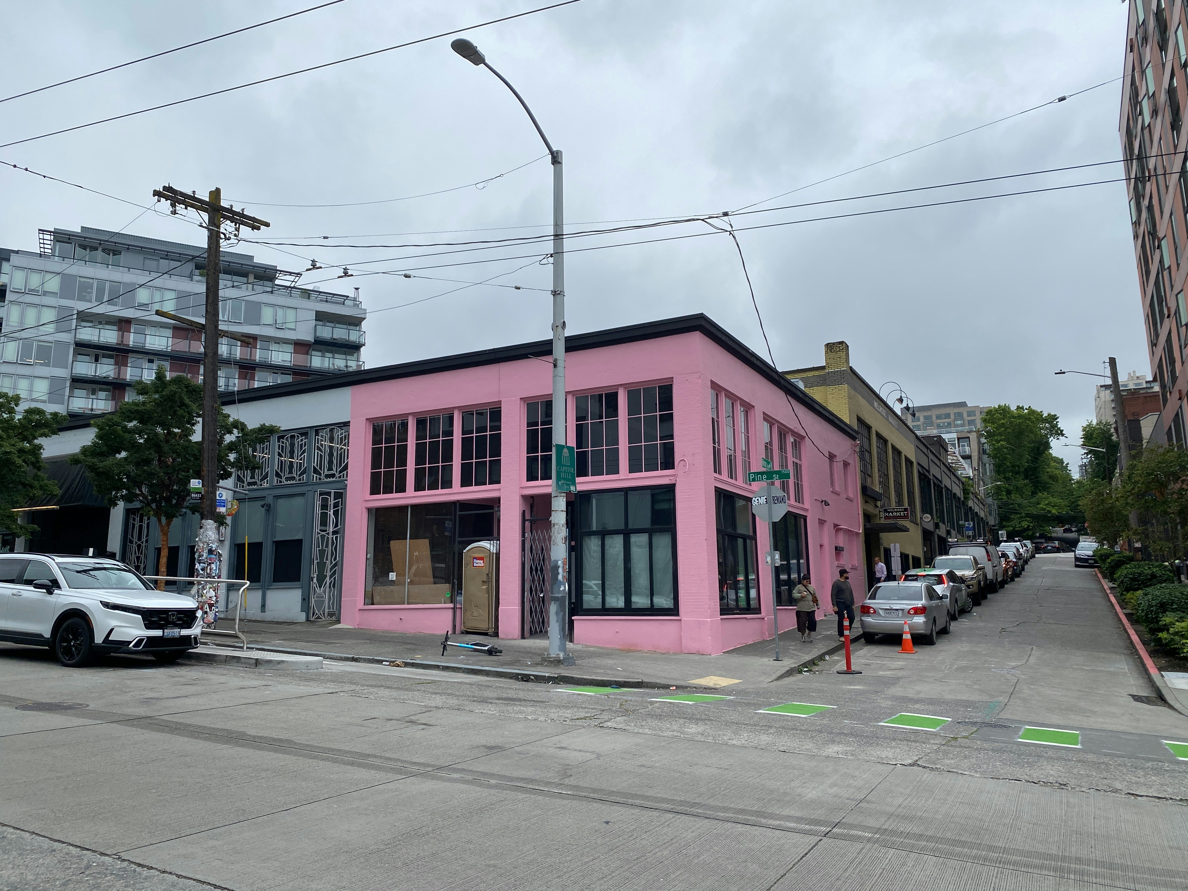 Coral Corner: The Bold Pink Facade on a Quiet City Block