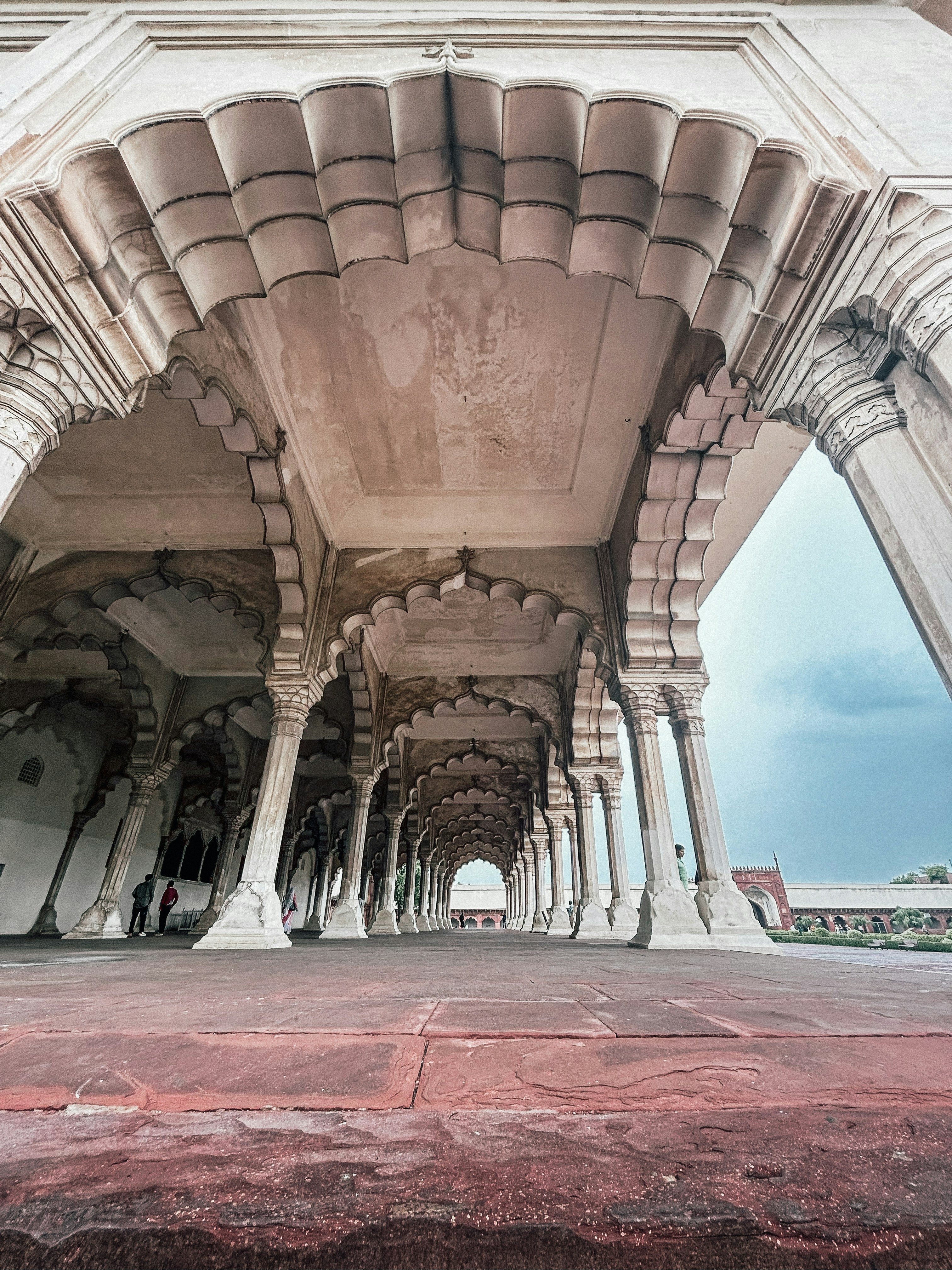 A large building with arches and arches on the side of it photo – Free ...