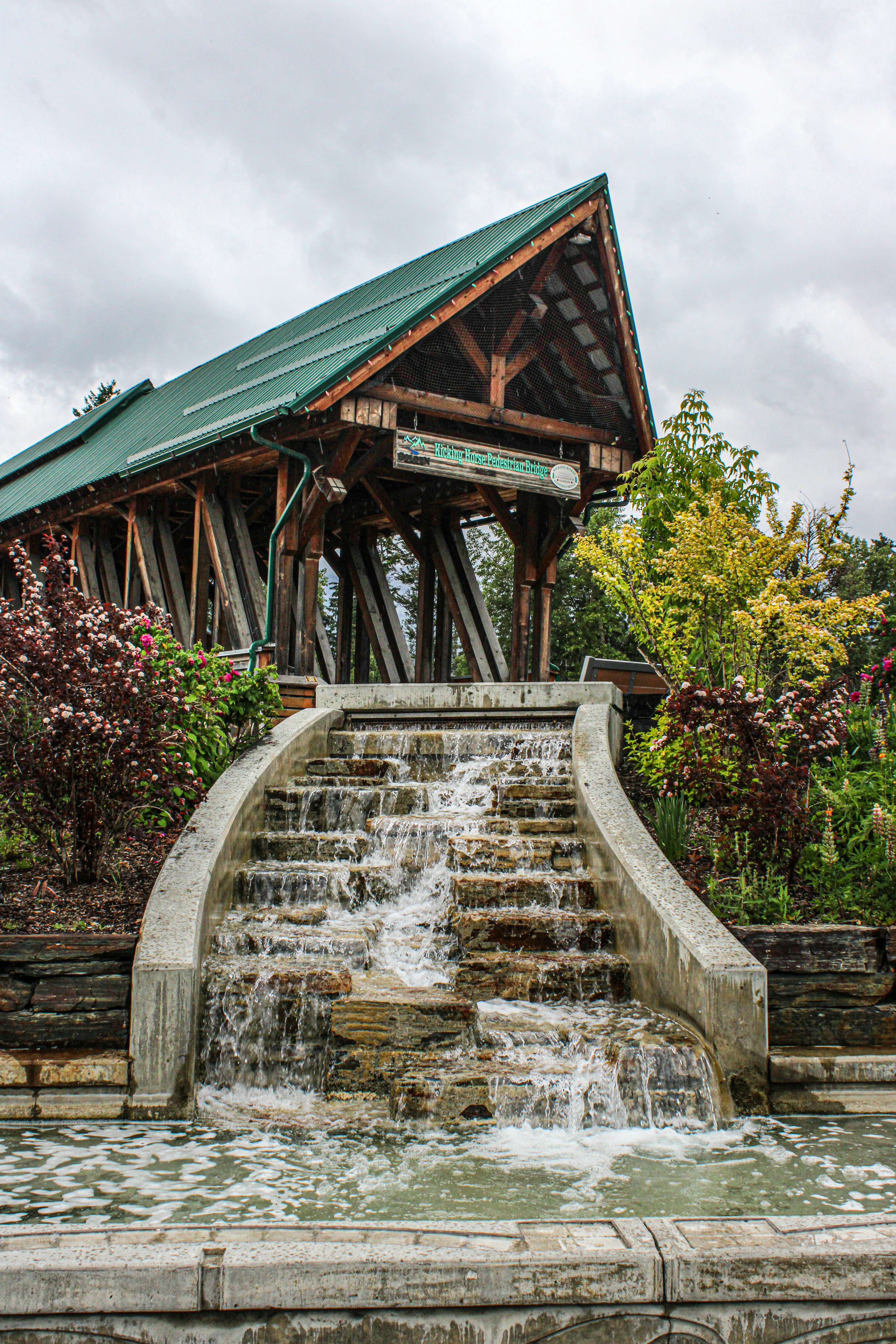 Cascade Staircase Beneath a Green-Roof Timber Pavilion