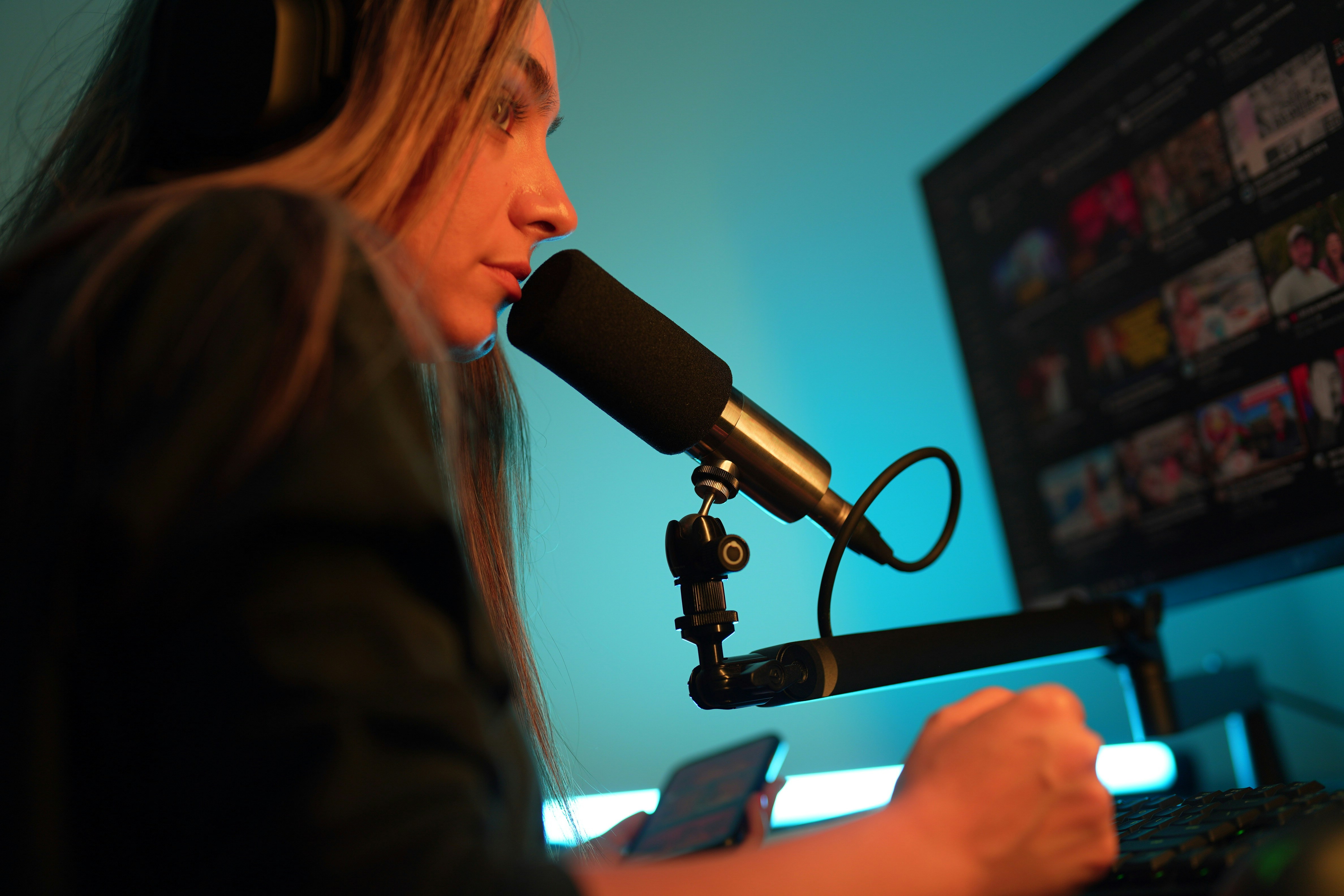 A woman in a recording studio with a microphone photo – Free Romania ...