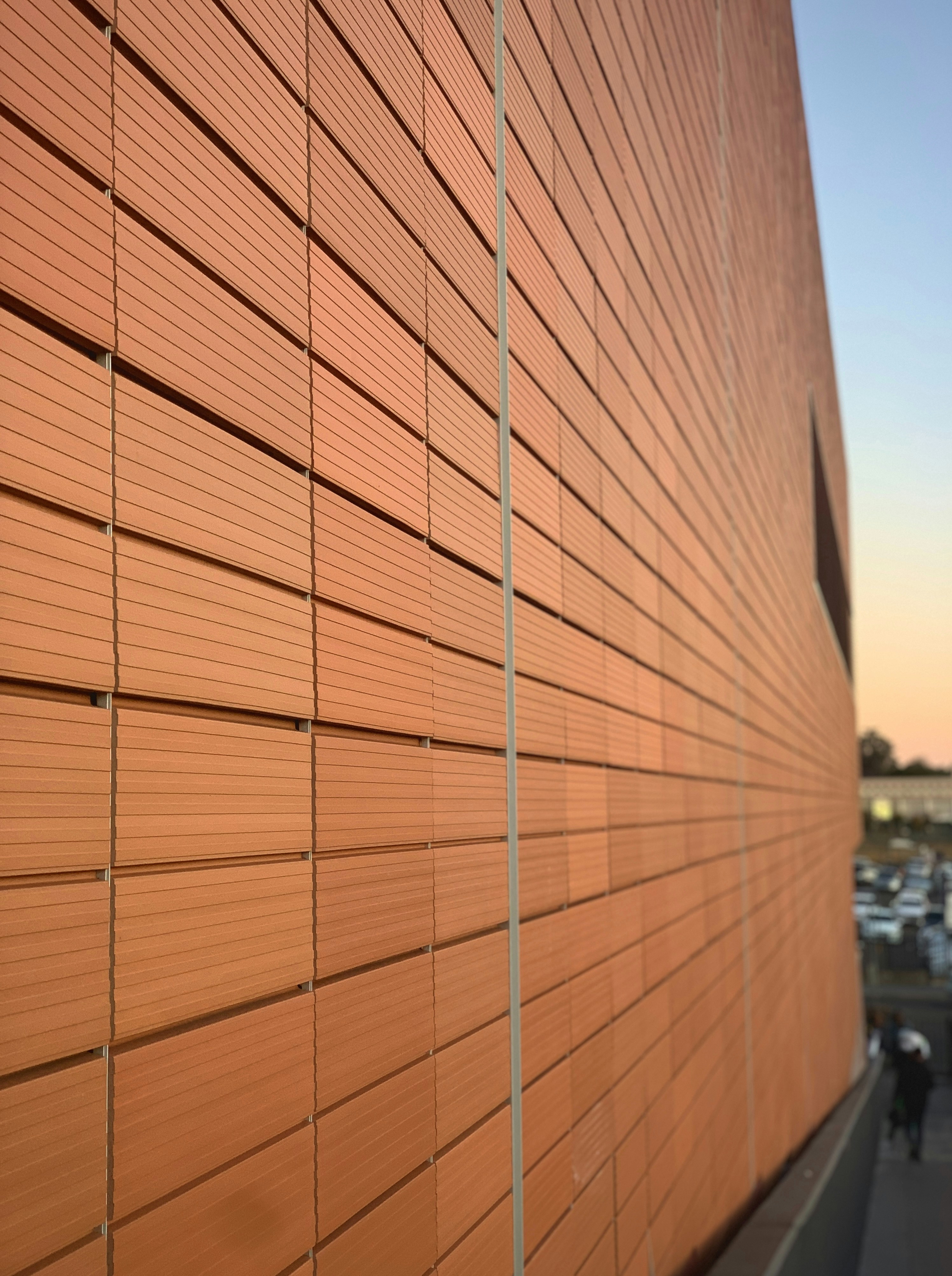 The line patterns of a wall of a building at sunset
