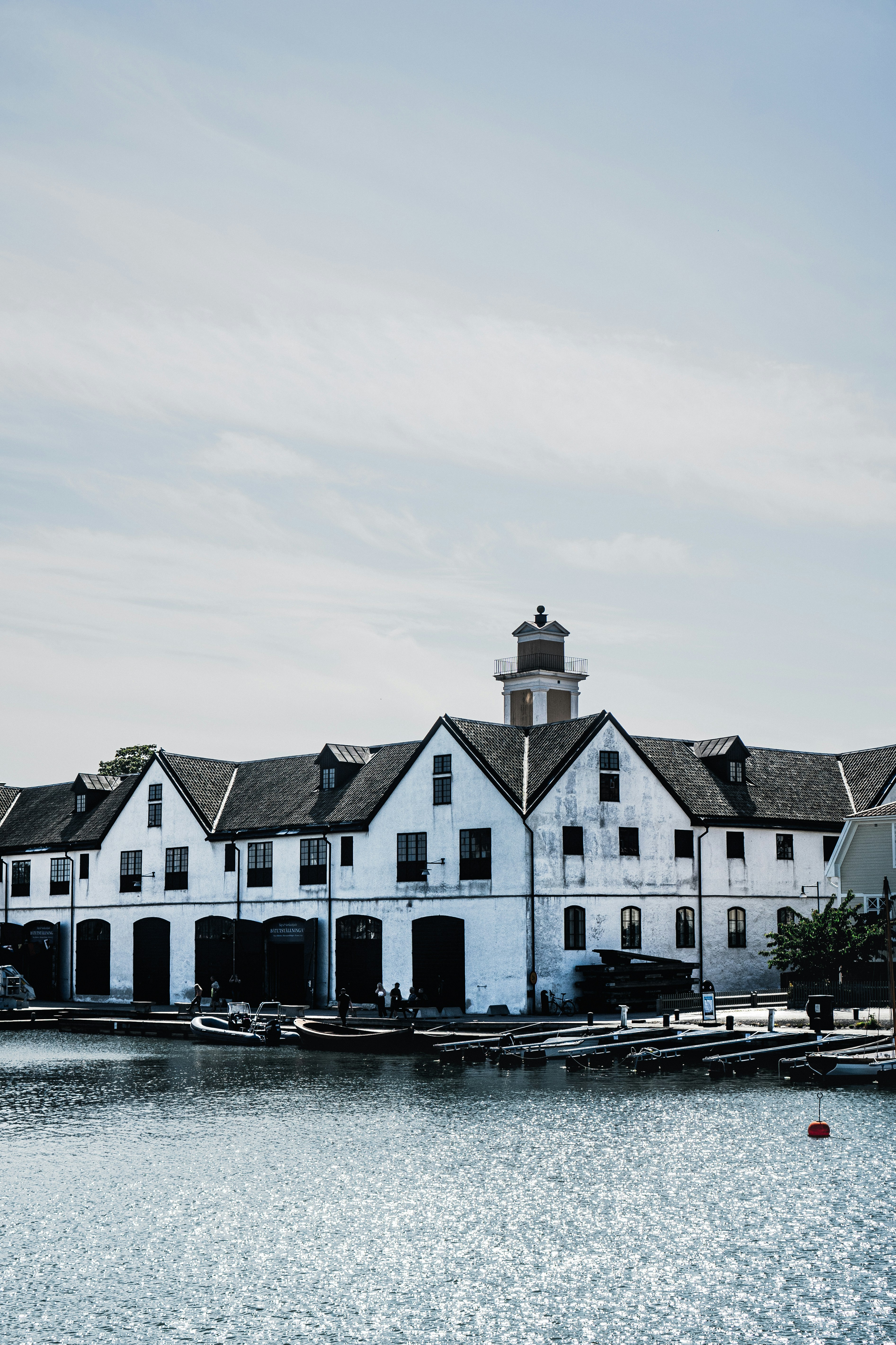 Cupola Over the Wharf: White Warehouses Framing a Calm Harbor