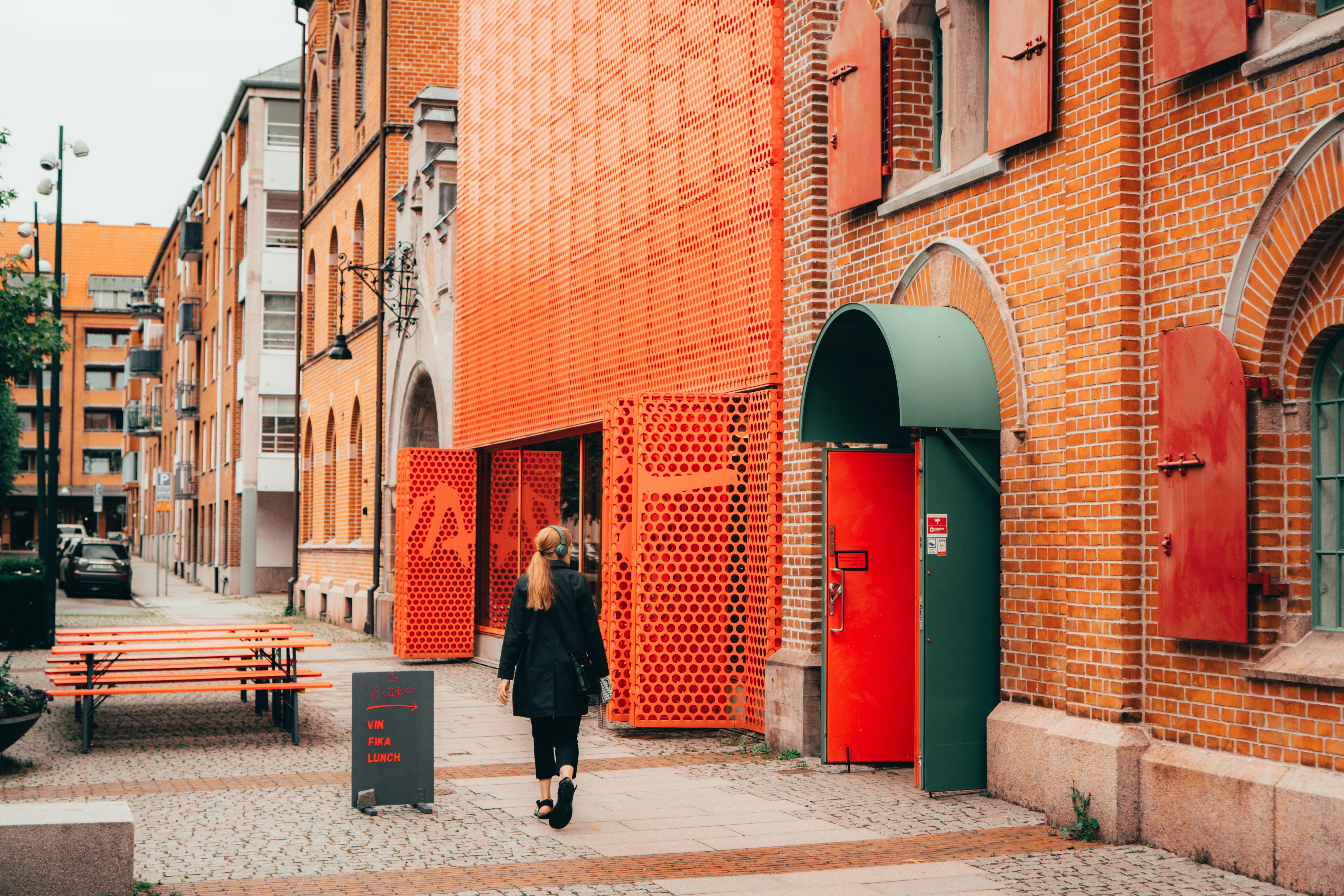Green Archway, Red Gates: A Quiet City Moment
