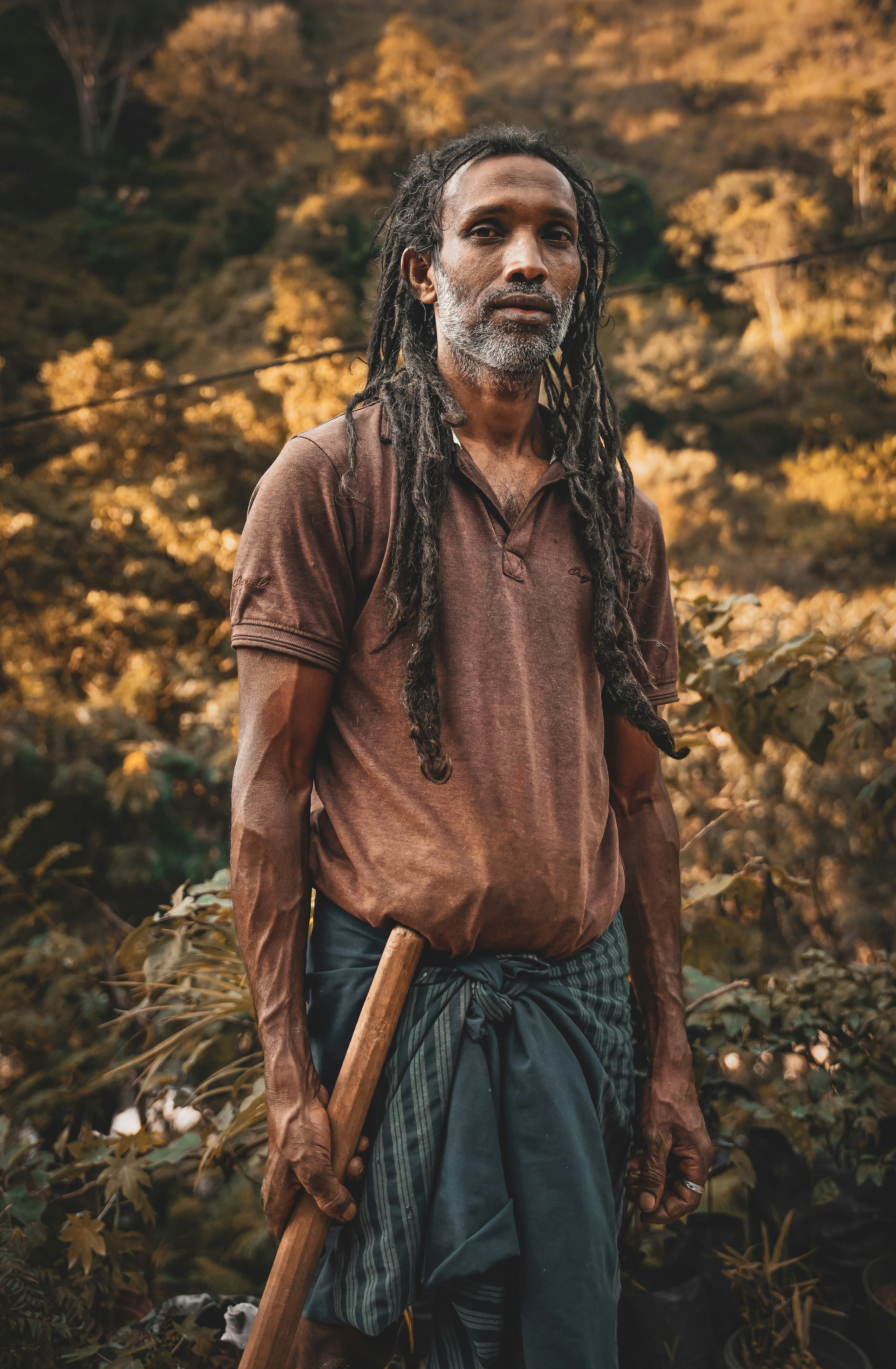 A man with dreadlocks standing in a forest photo – Free Forest Image on ...
