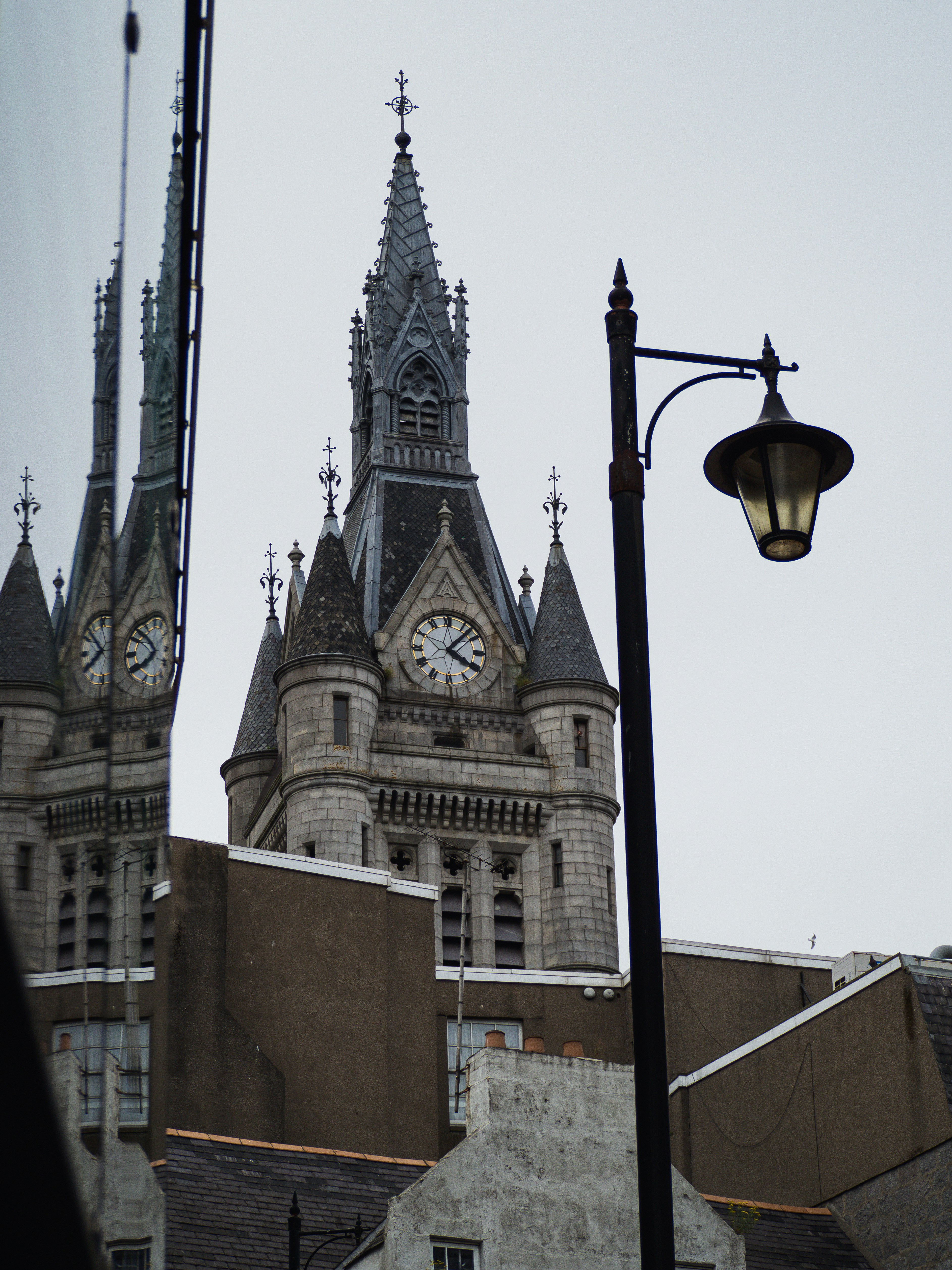 Gothic Clocktower Rising Over a Quiet City Street