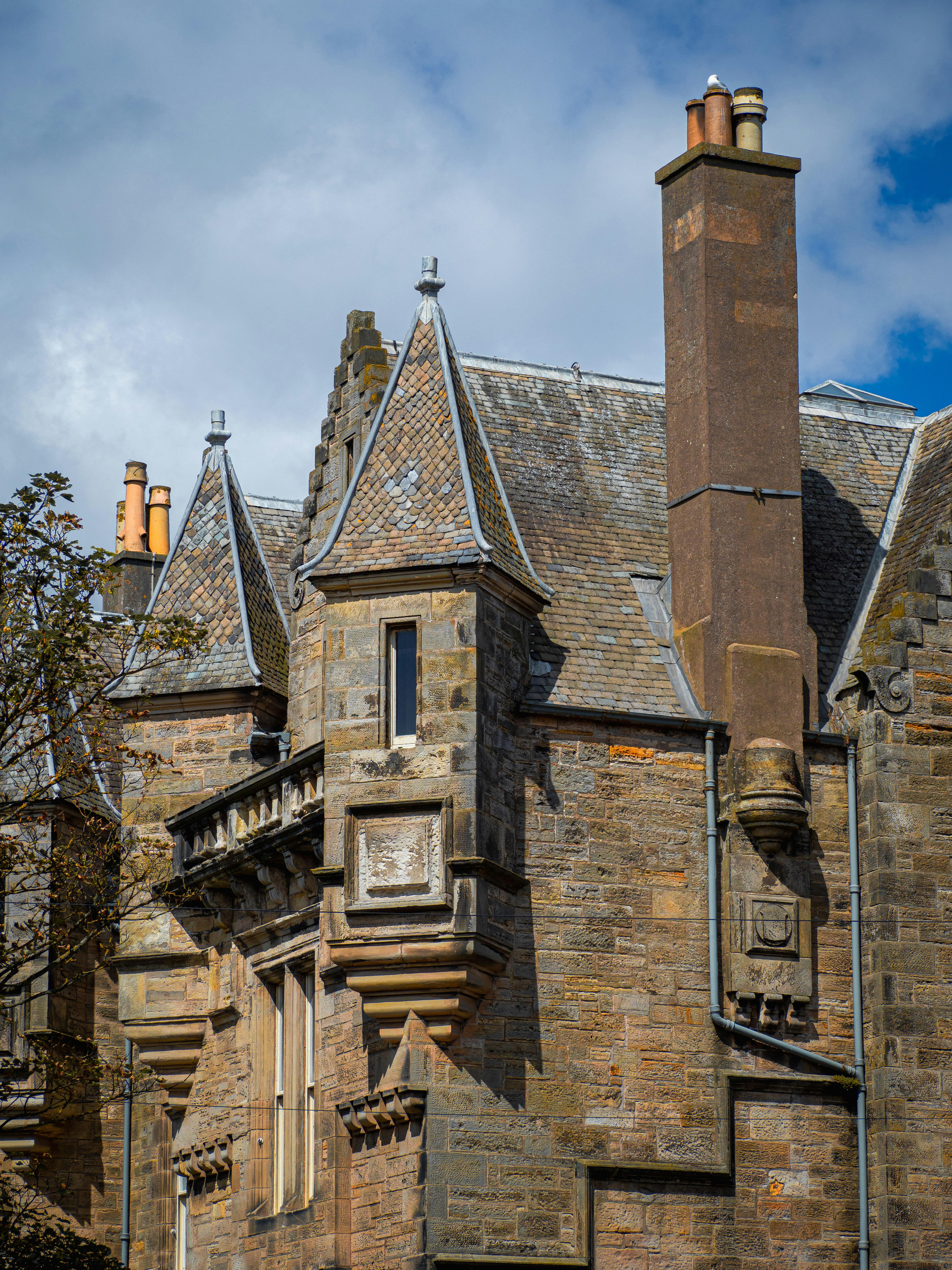 Turreted Stone Facade Rising Under a Clear Blue Sky