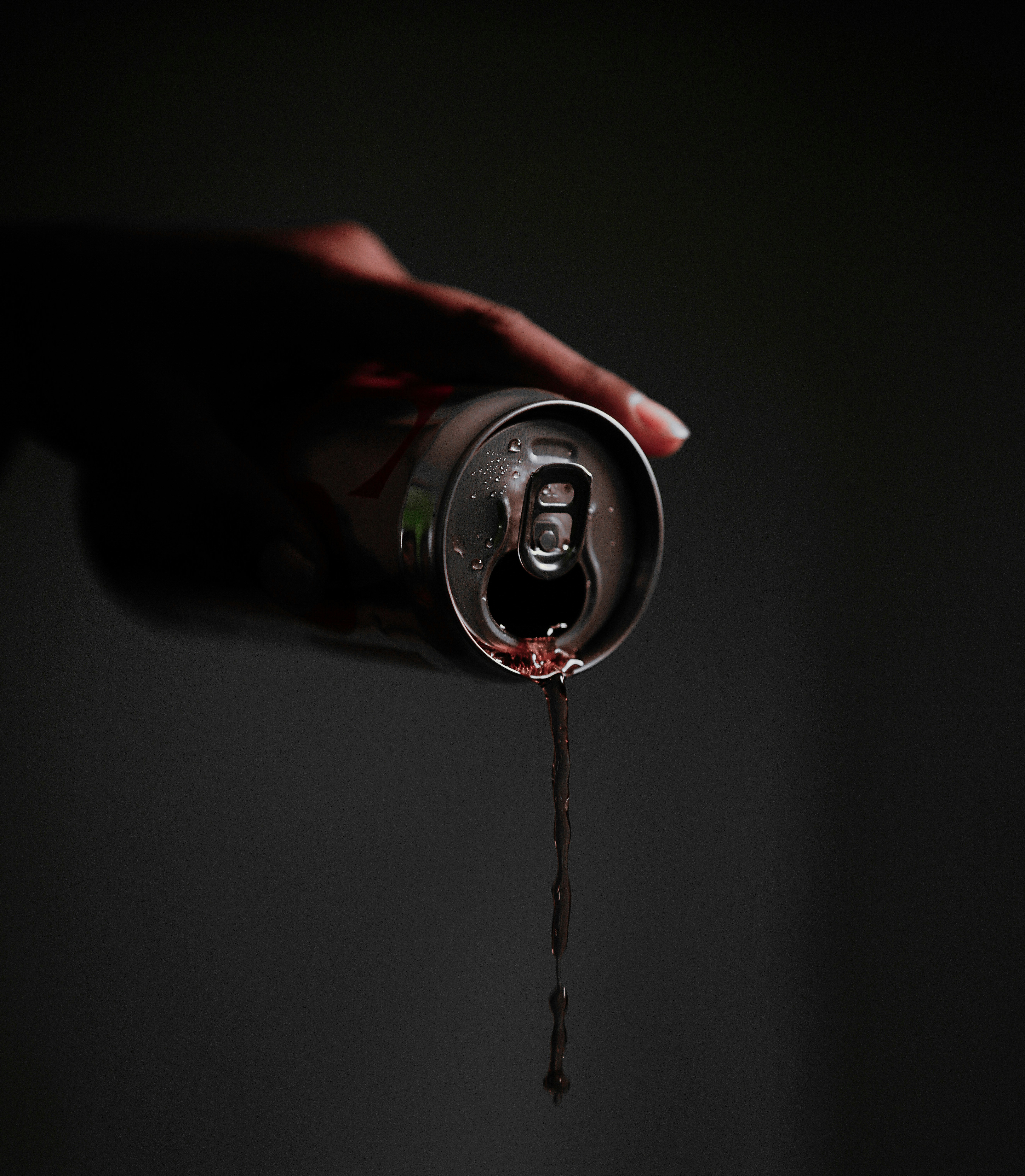 A person holding a can of soda in their hand photo – Free Wallpaper ...