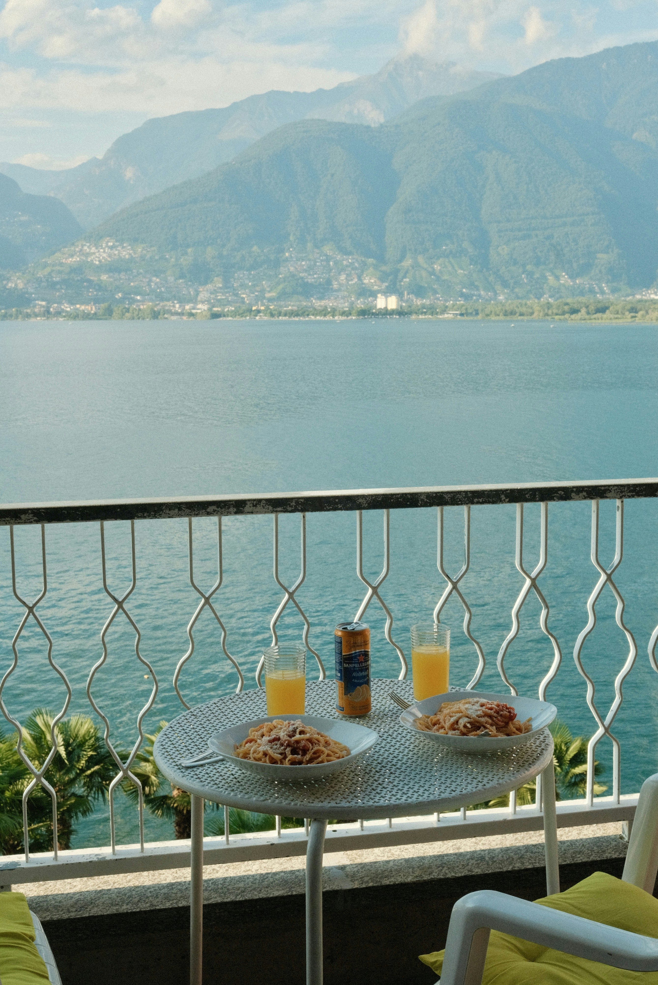 Pasta for Two on a Lakefront Balcony, Framed by Alpine Peaks