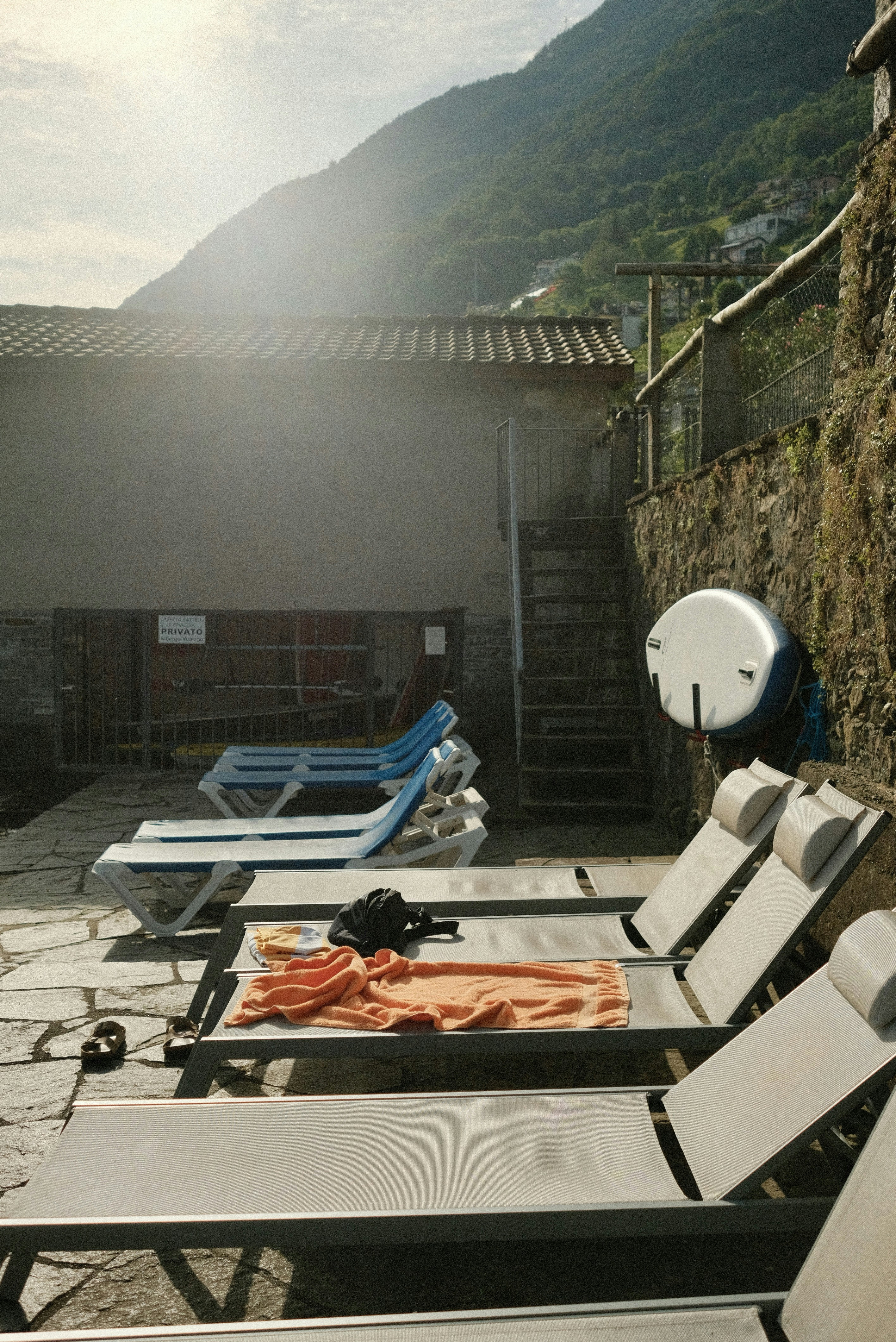 Orange Towel on Poolside Row Amid Mountain Terrace