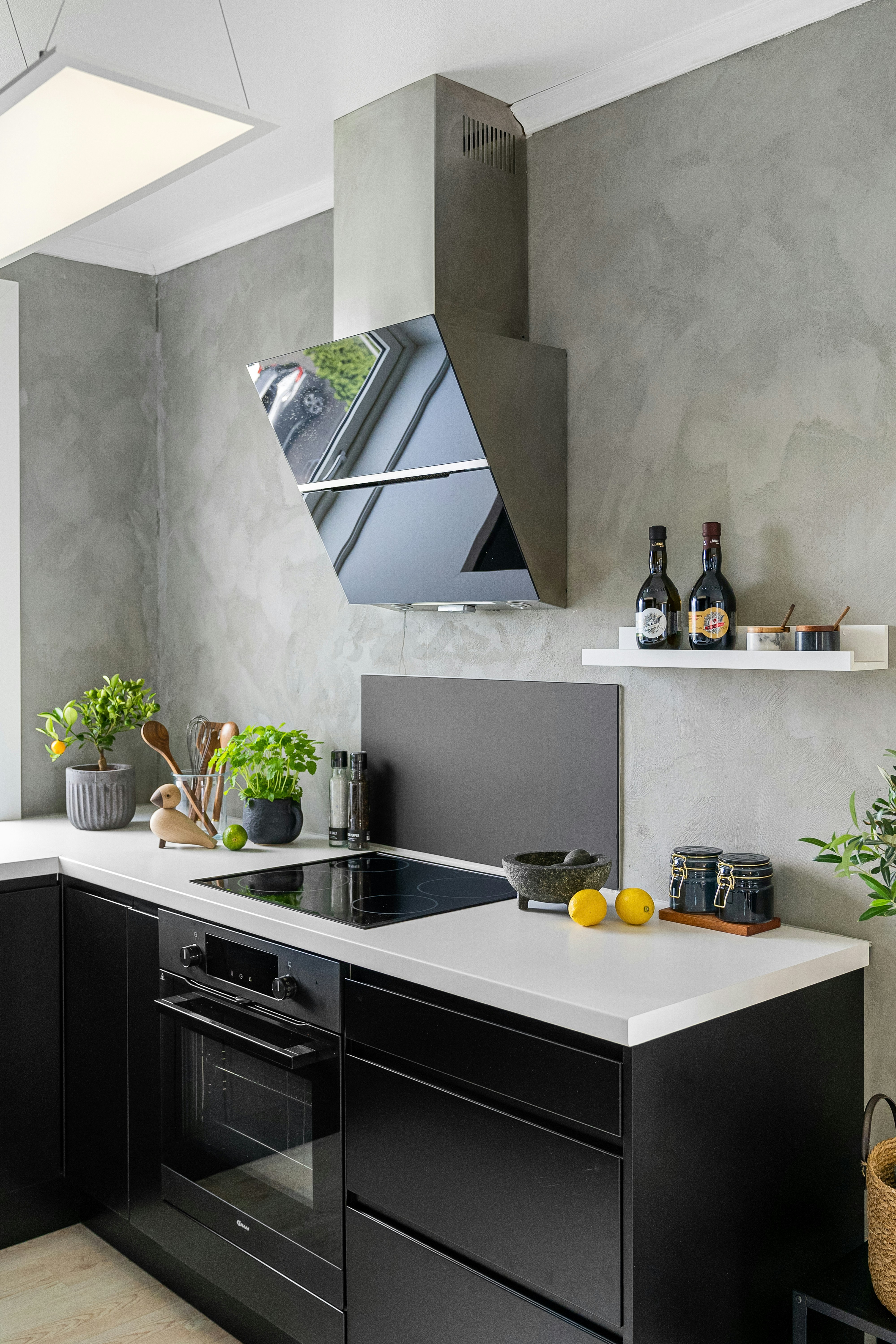 A kitchen with black cabinets and white counter tops photo – Free ...