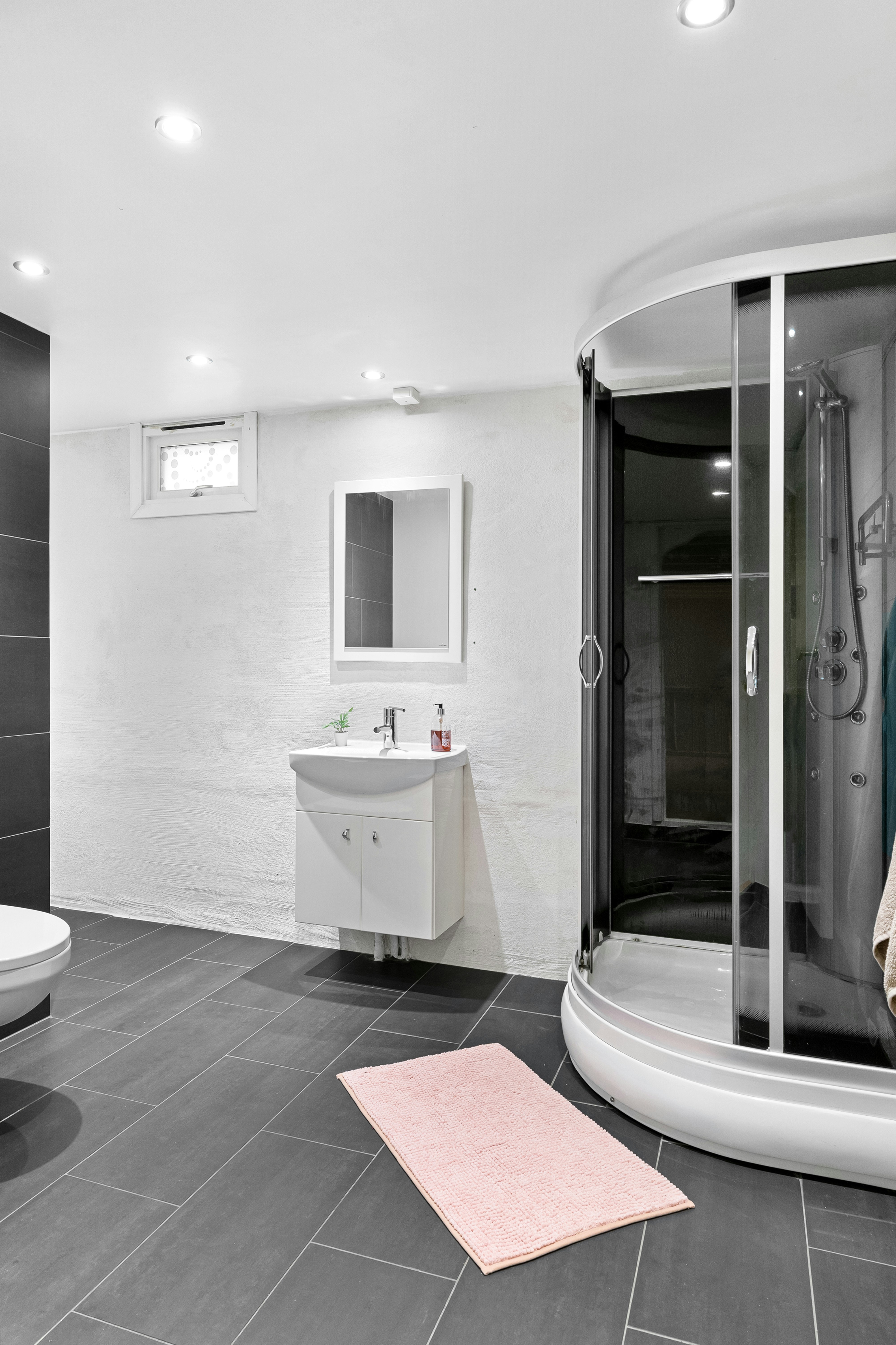 A large bathroom with a walk in shower next to a sink photo – Free ...