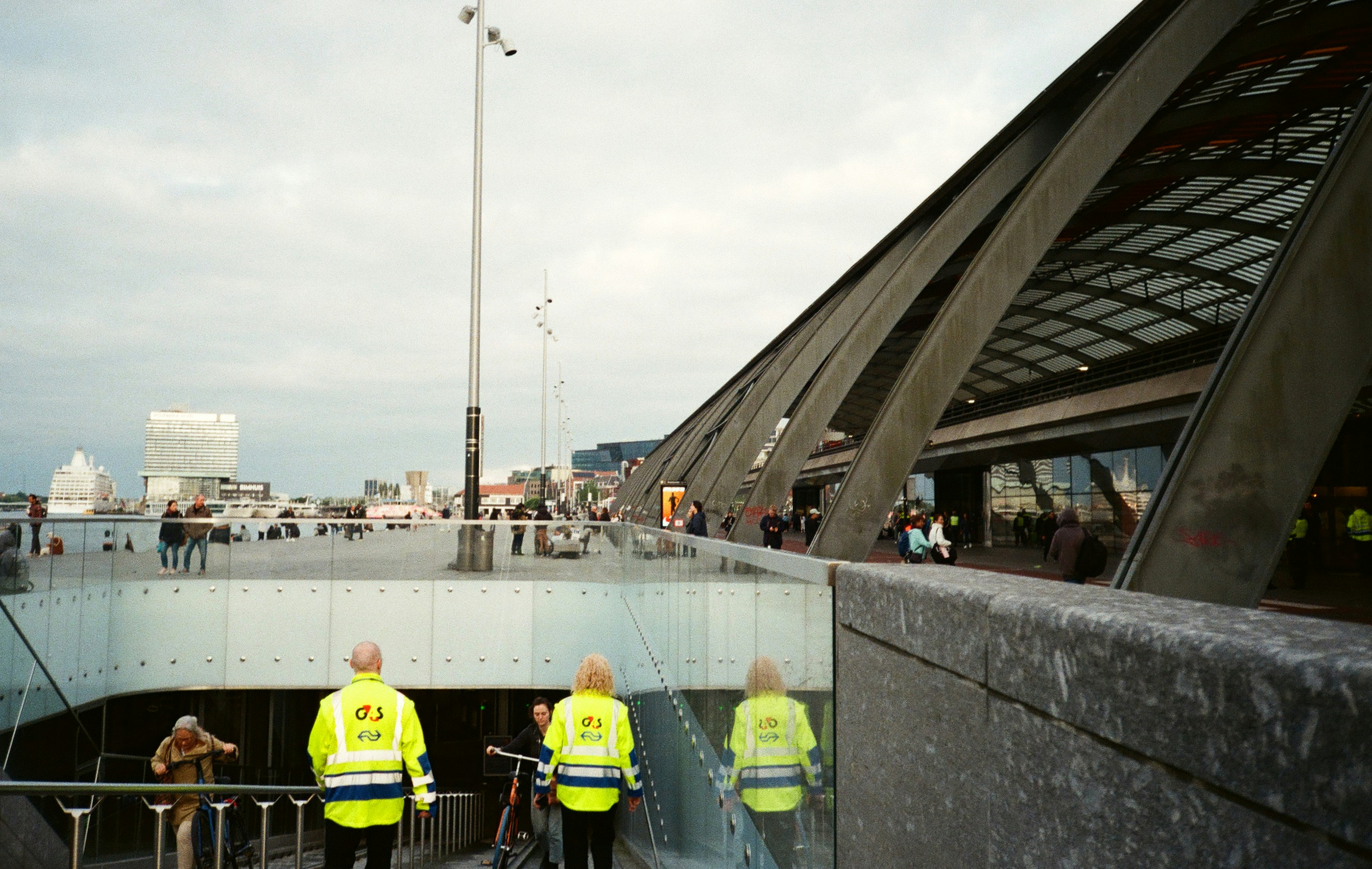 A group of people standing on top of a bridge photo – Free Amsterdam ...