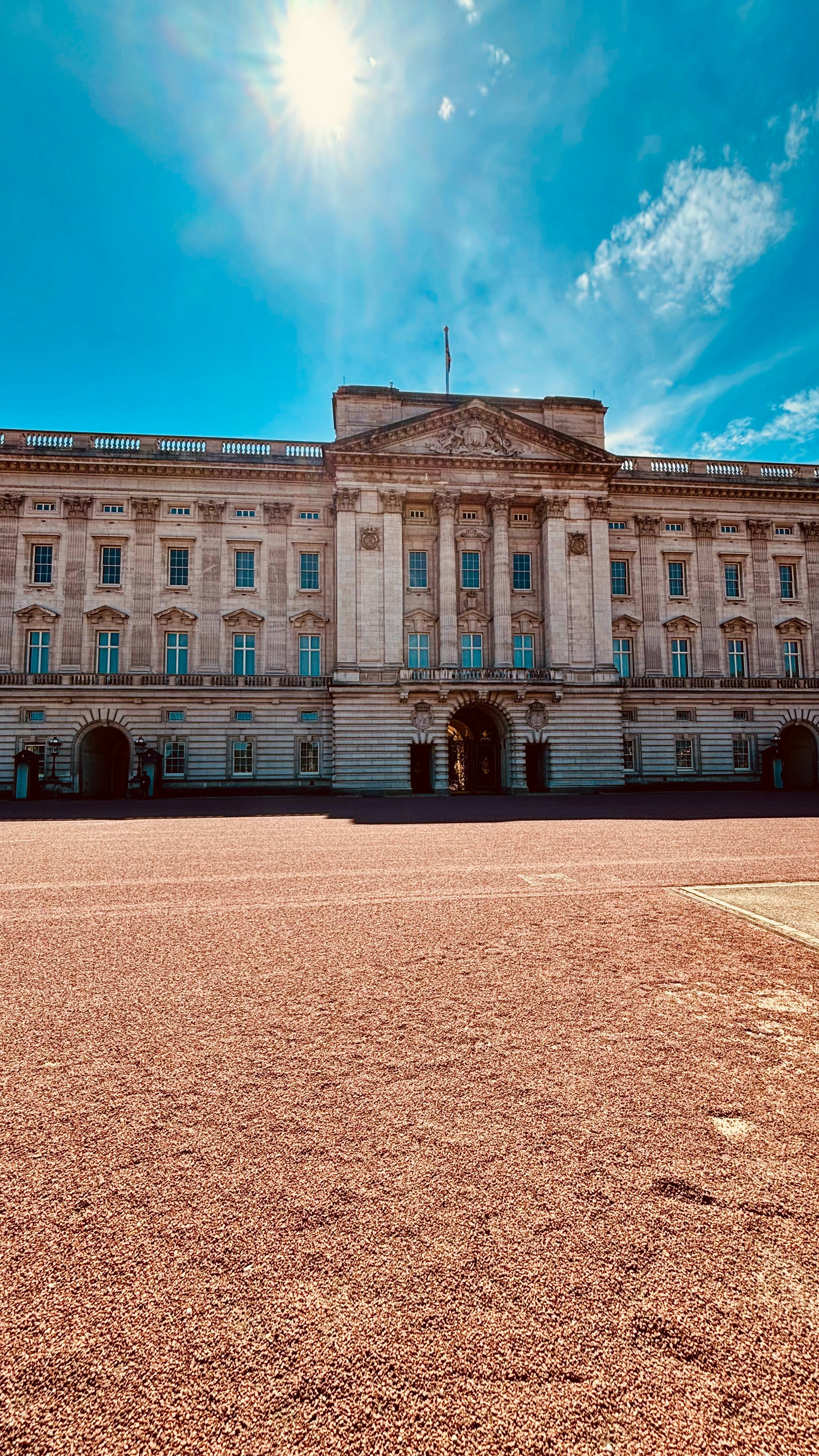 Symmetry in Stone: The Grand Entrance of a Sunlit Palace