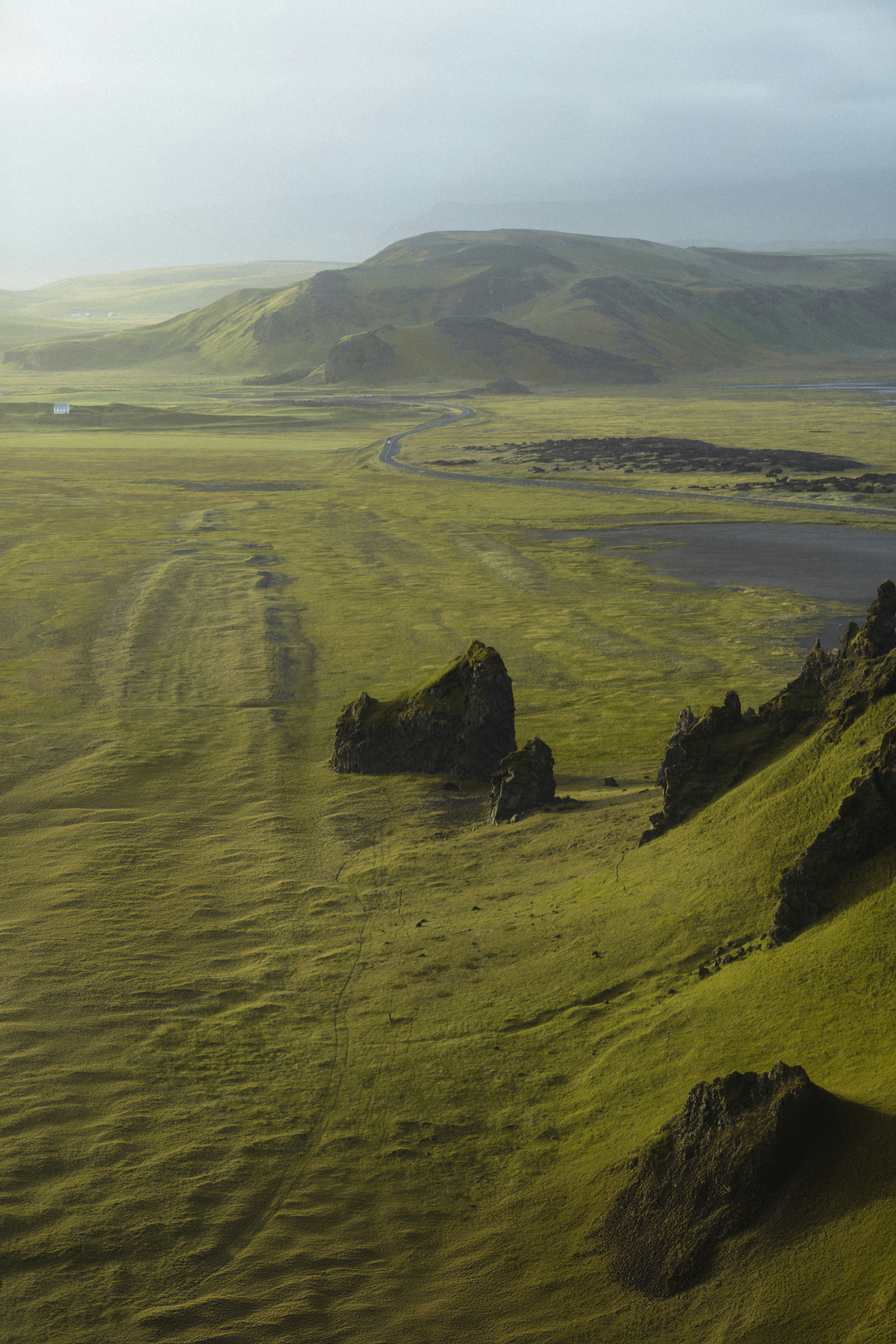 An aerial view of a grassy plain with a river running through it photo ...