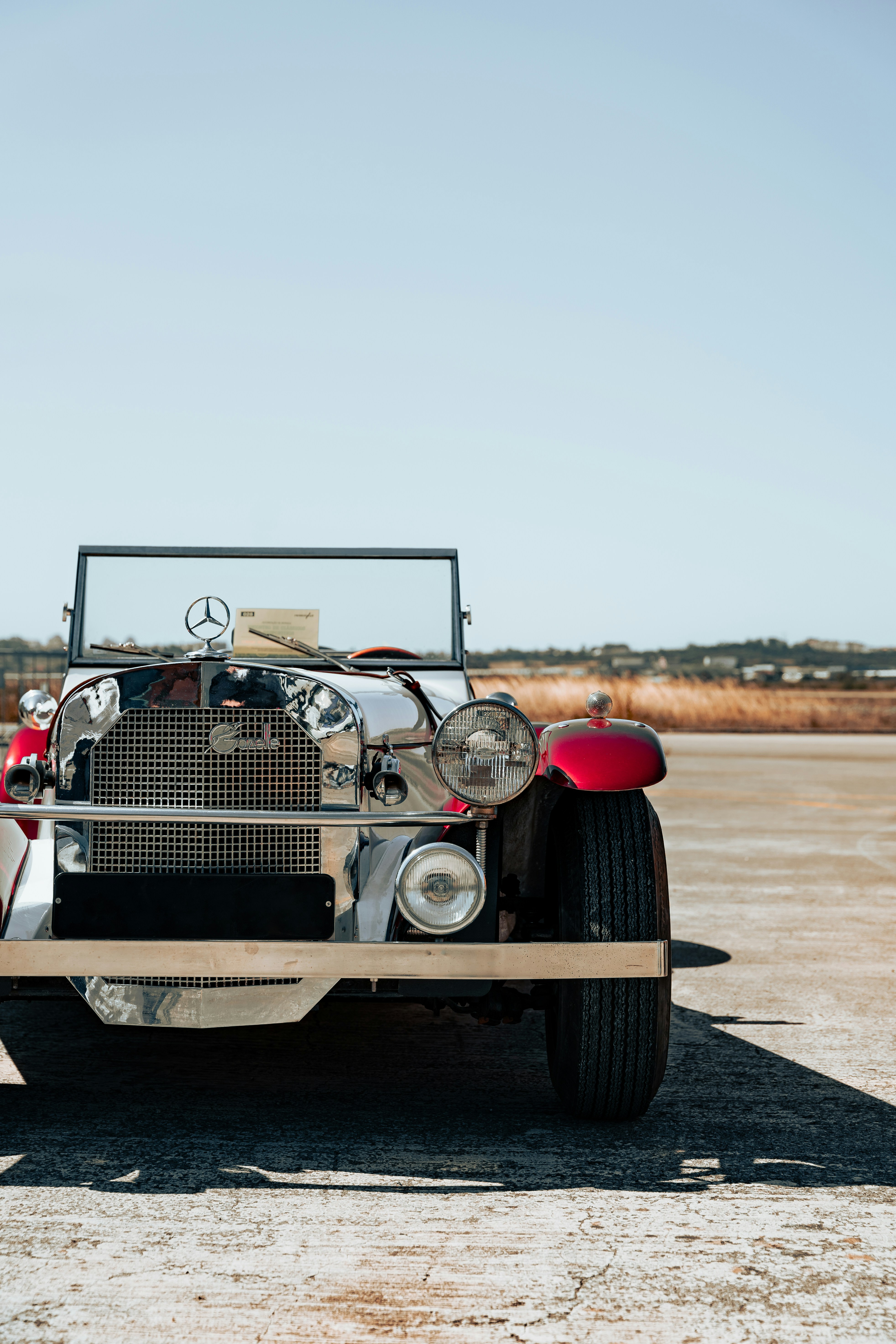 Chrome Grille, Open Road: A Vintage Mercedes Roadster Front View