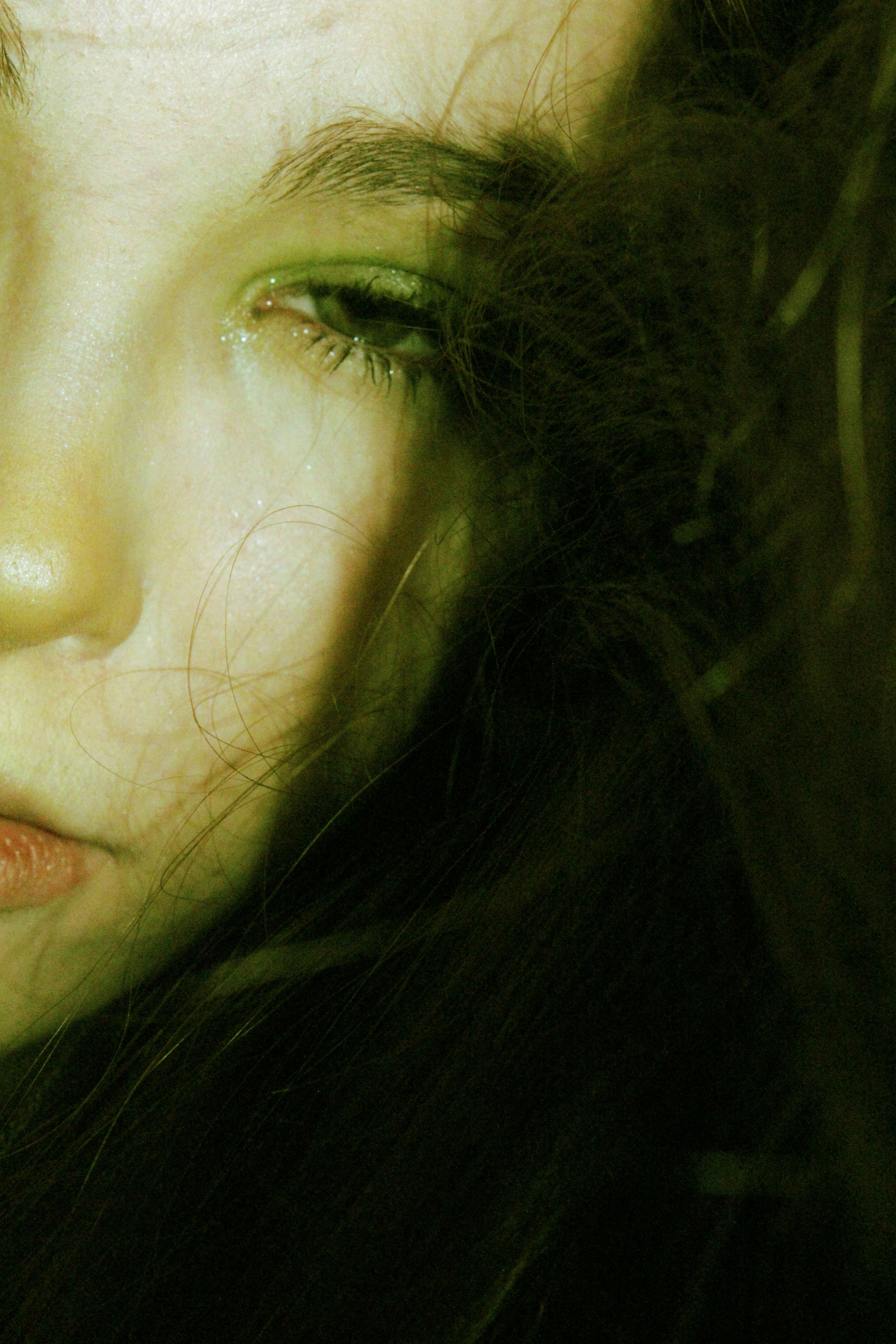 Green-Tinted Half-Face: A Quiet Close-Up Portrait