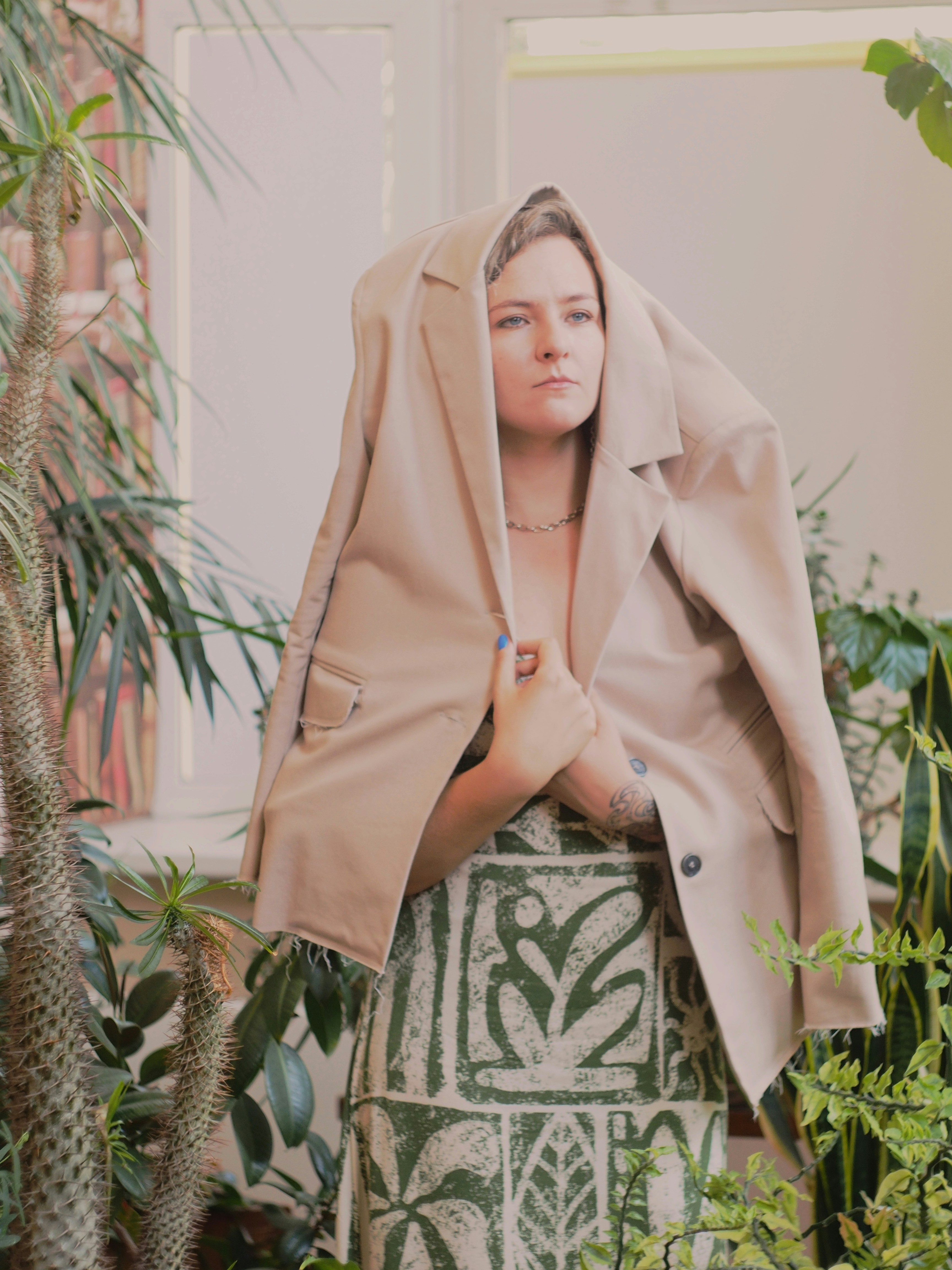 Beige Mantle, Quiet Resolve in an Indoor Jungle