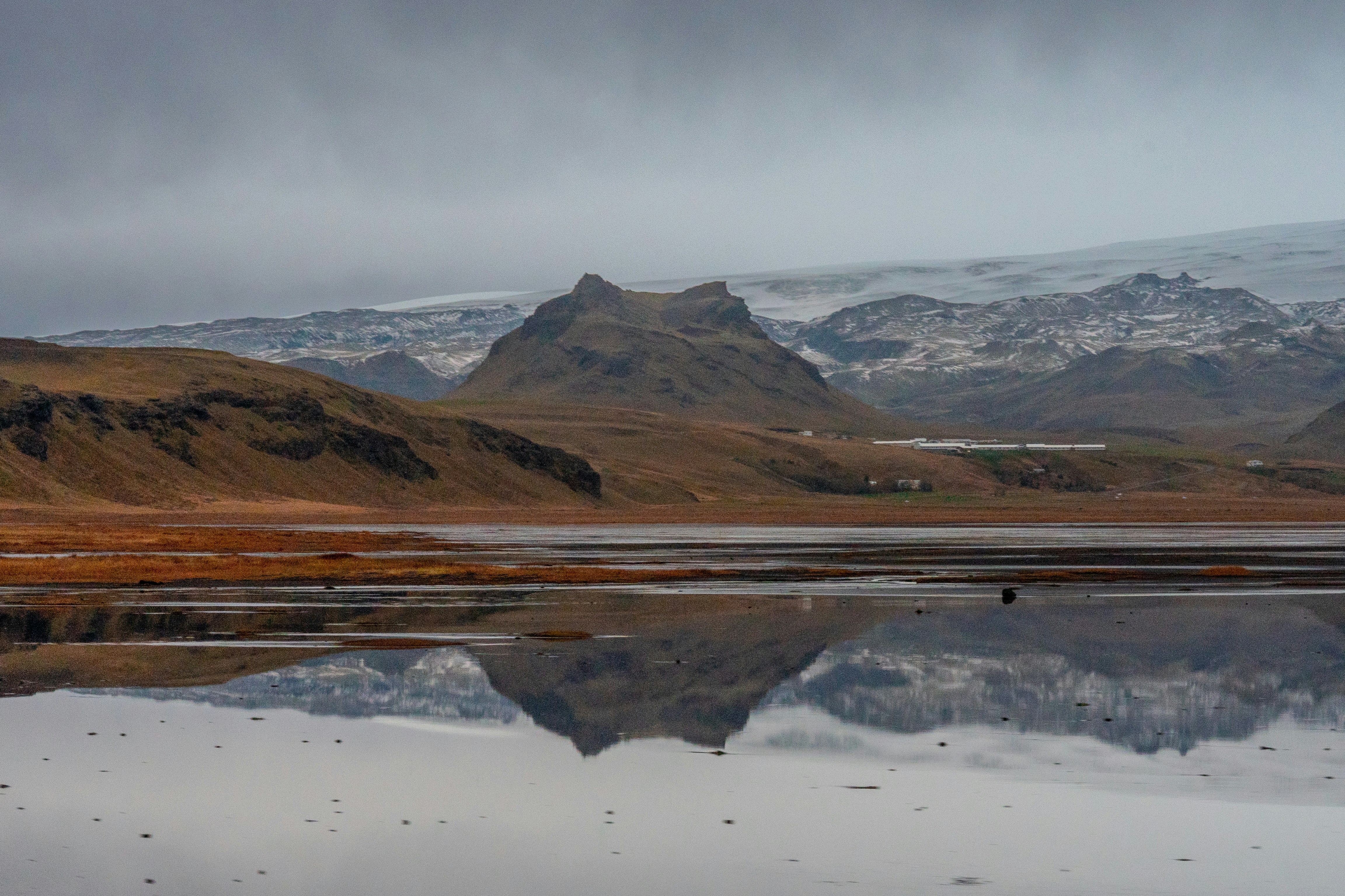 Echo Ridge over Glass Lake: Reflections Under a Moody Sky