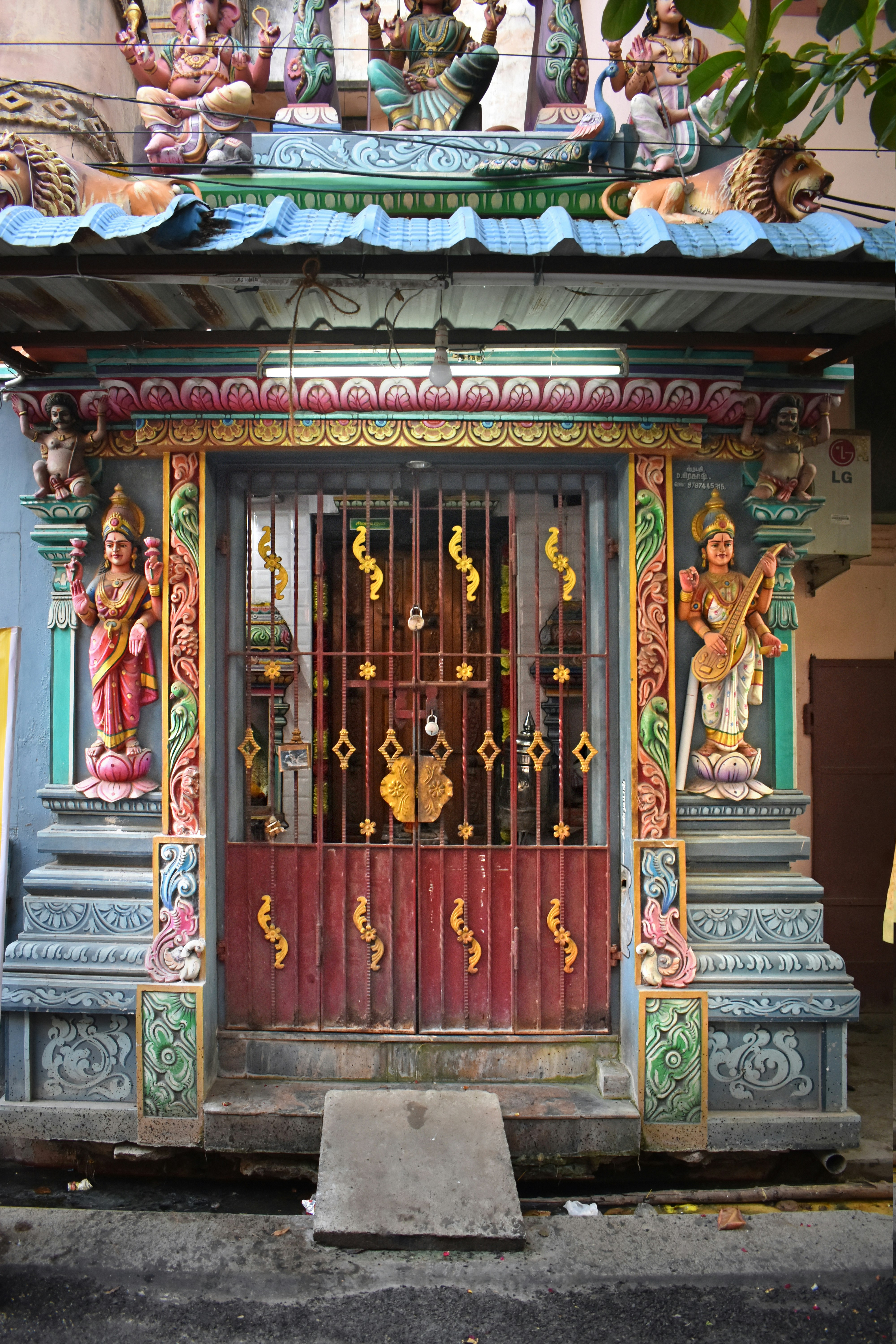 The Guardians of Tradition: A Colorful Temple Entrance