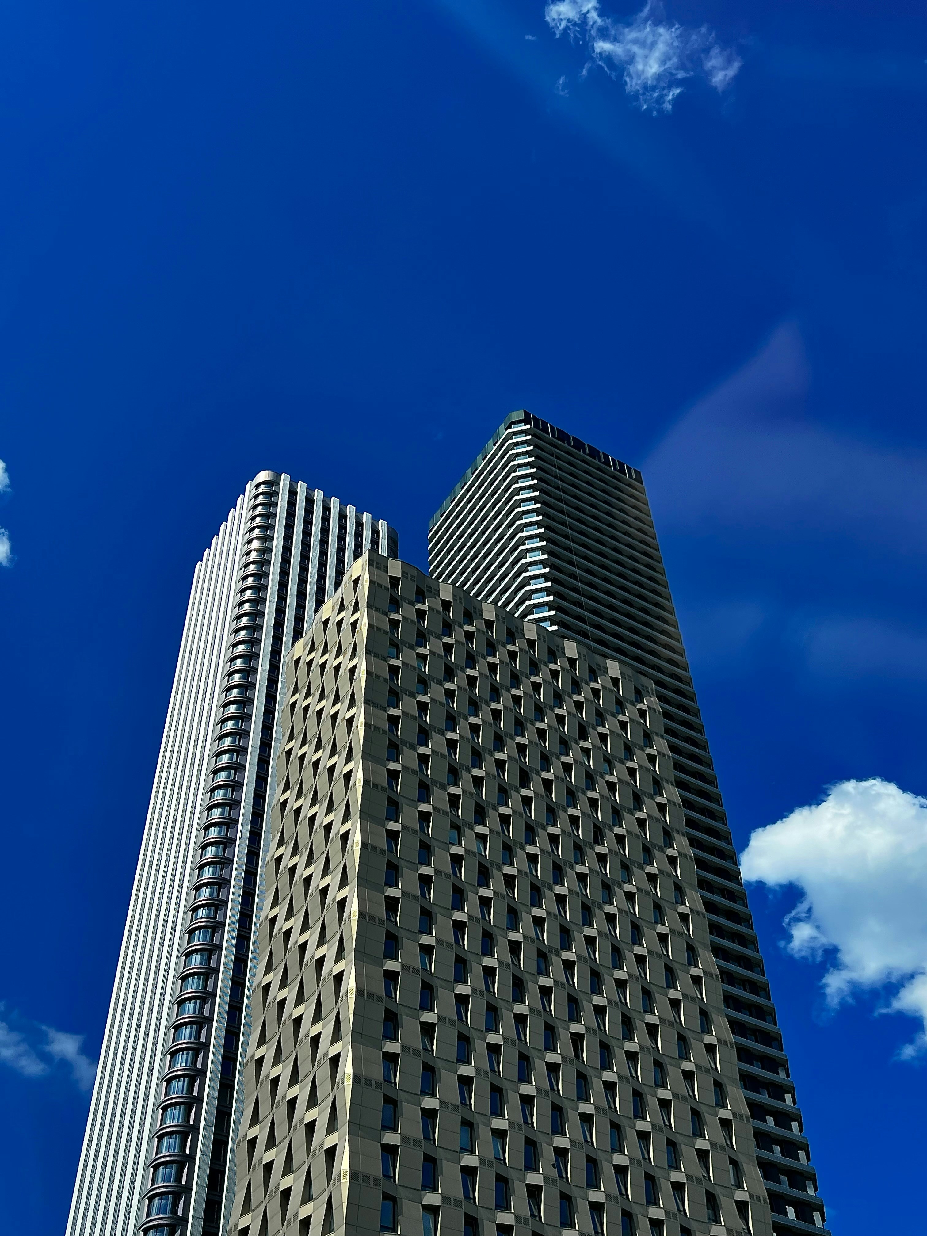 Triad of Facades: Geometry Reaches into a Cerulean Sky