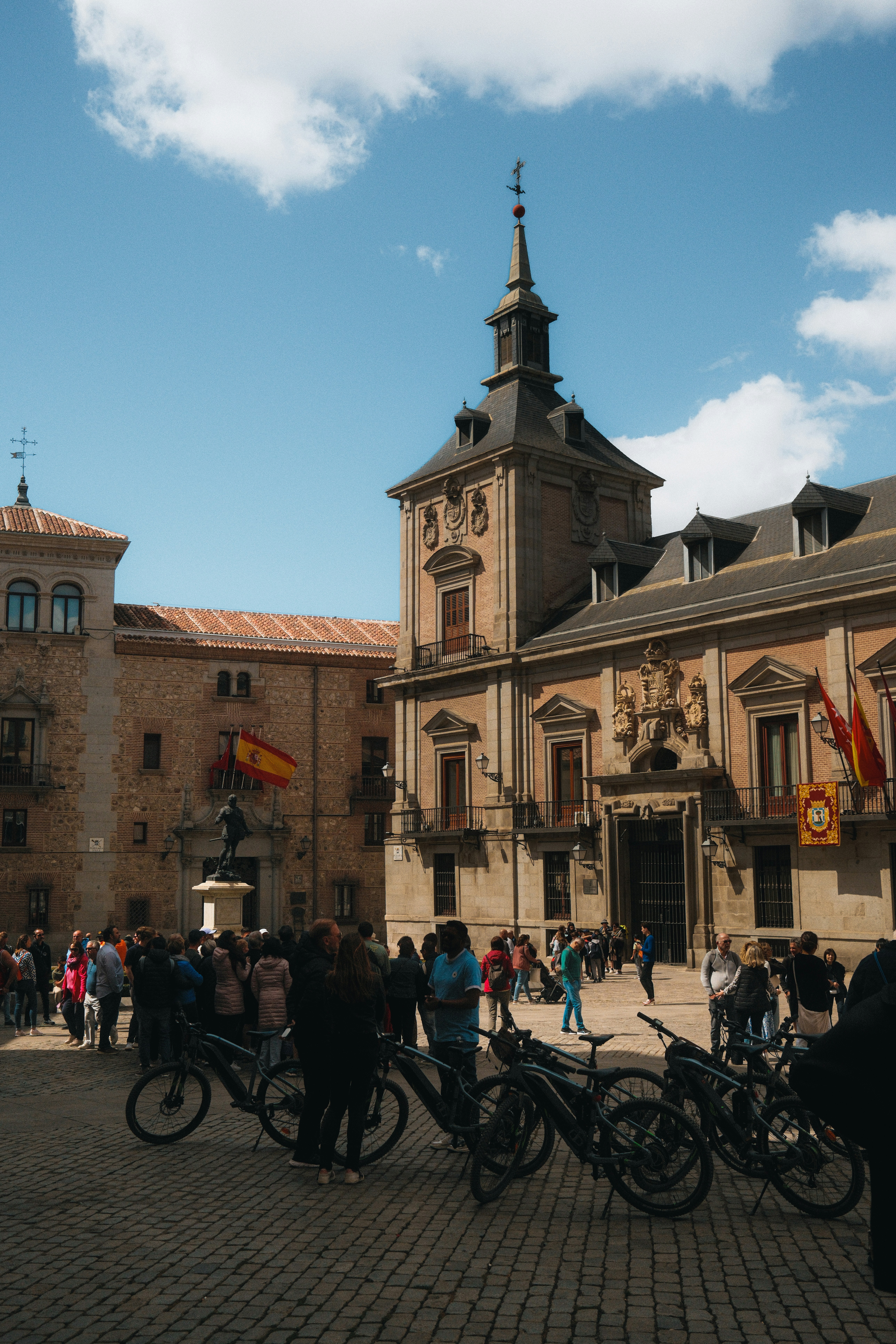 Towered Facade, Bicycles, and Sunlit Square: A Historic Plaza Snapshot