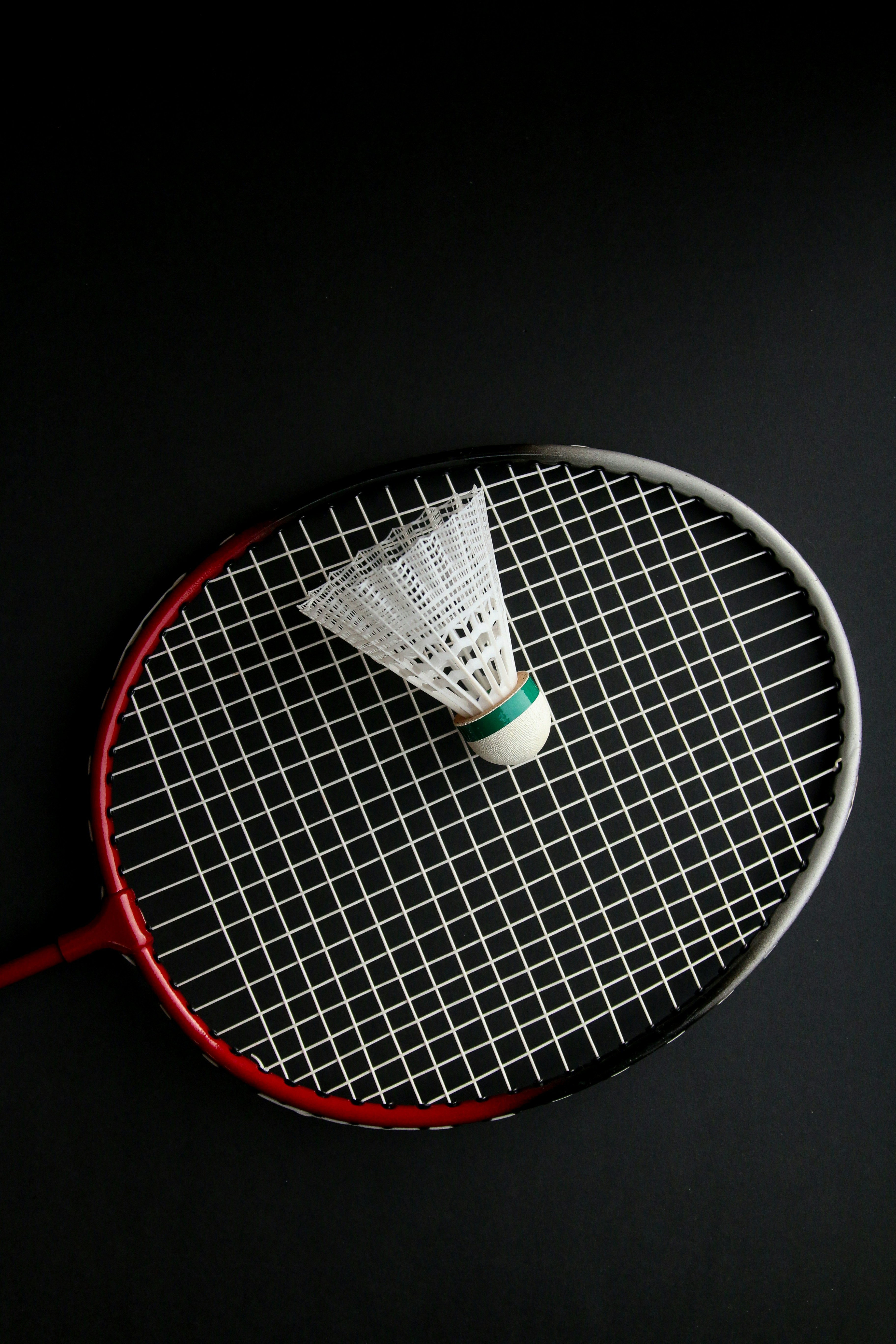 A badminton racket with a white shuttle on it photo – Free Racquet ...