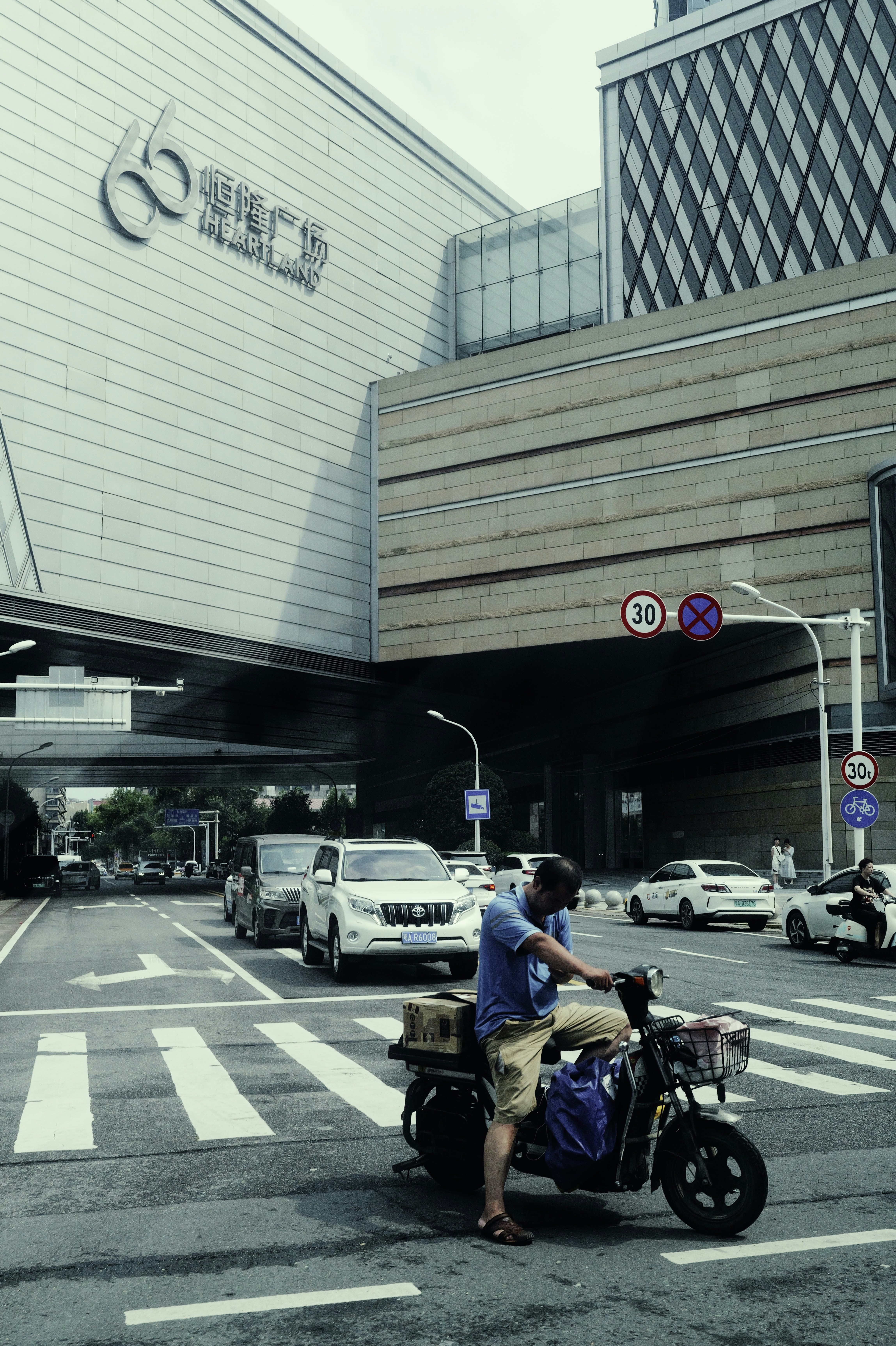 Crosswalk Courier: A Cargo Bike Navigates an Urban Canyon
