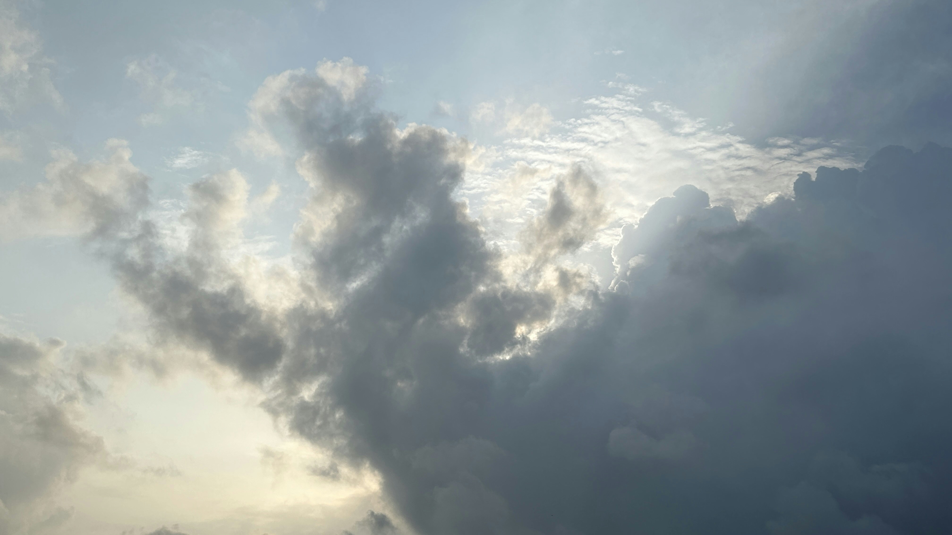 Sun Break Through a Crown of Clouds Across an Expansive Sky