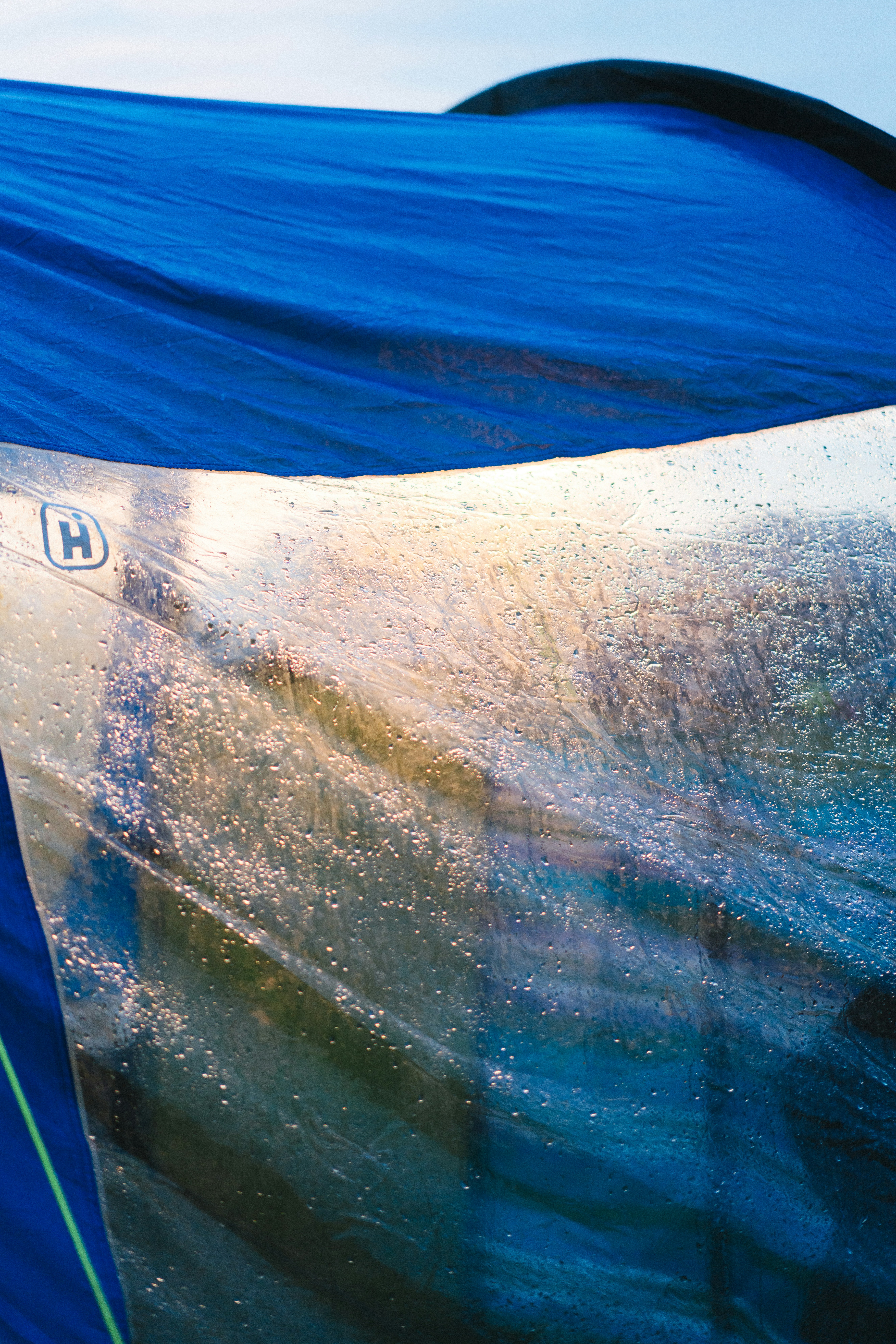 Blue Shelter: A Close-Up of Shelter Fabric Glazed with Dew