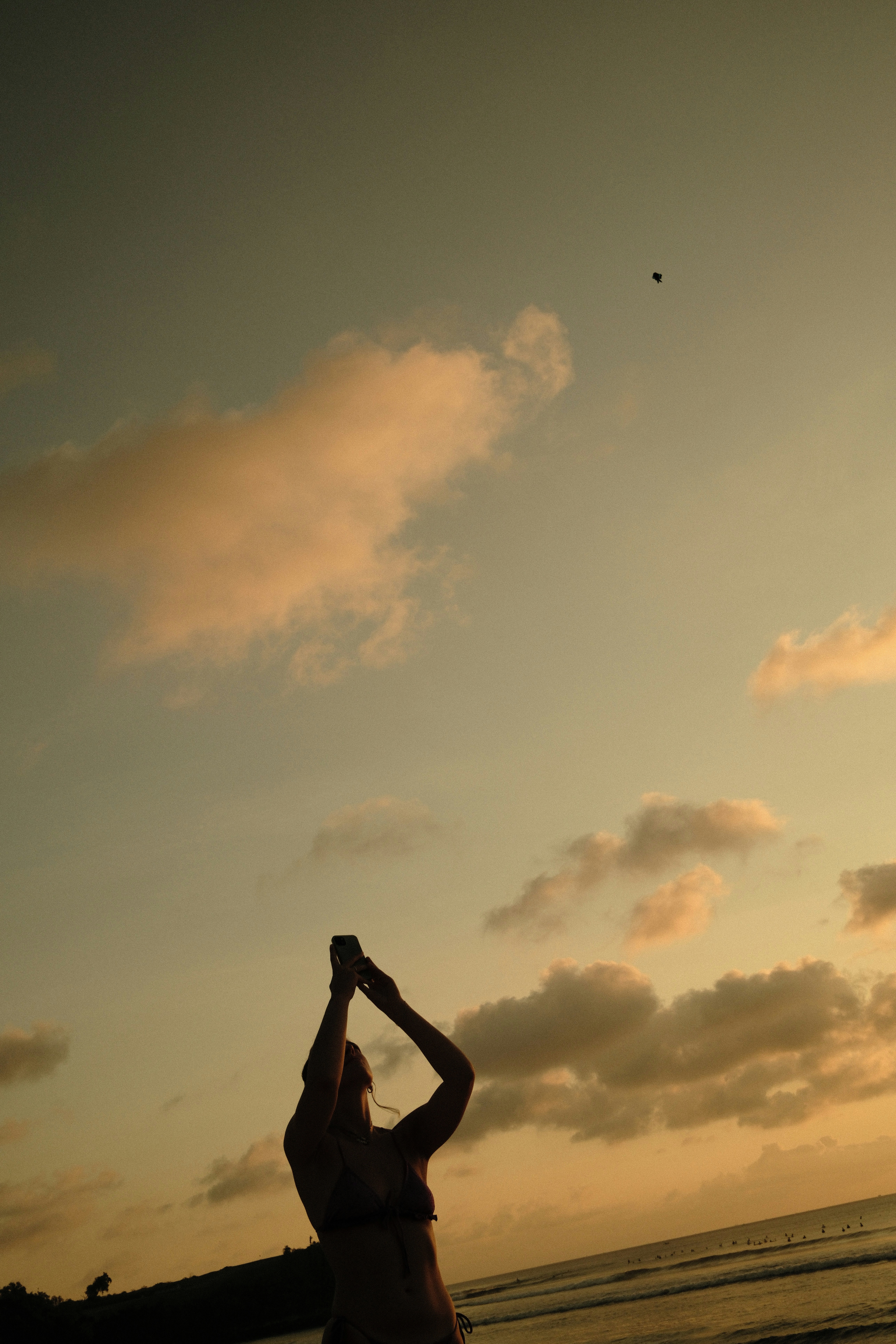 Silent Skyline: A Sunlit Selfie at Sea’s Edge