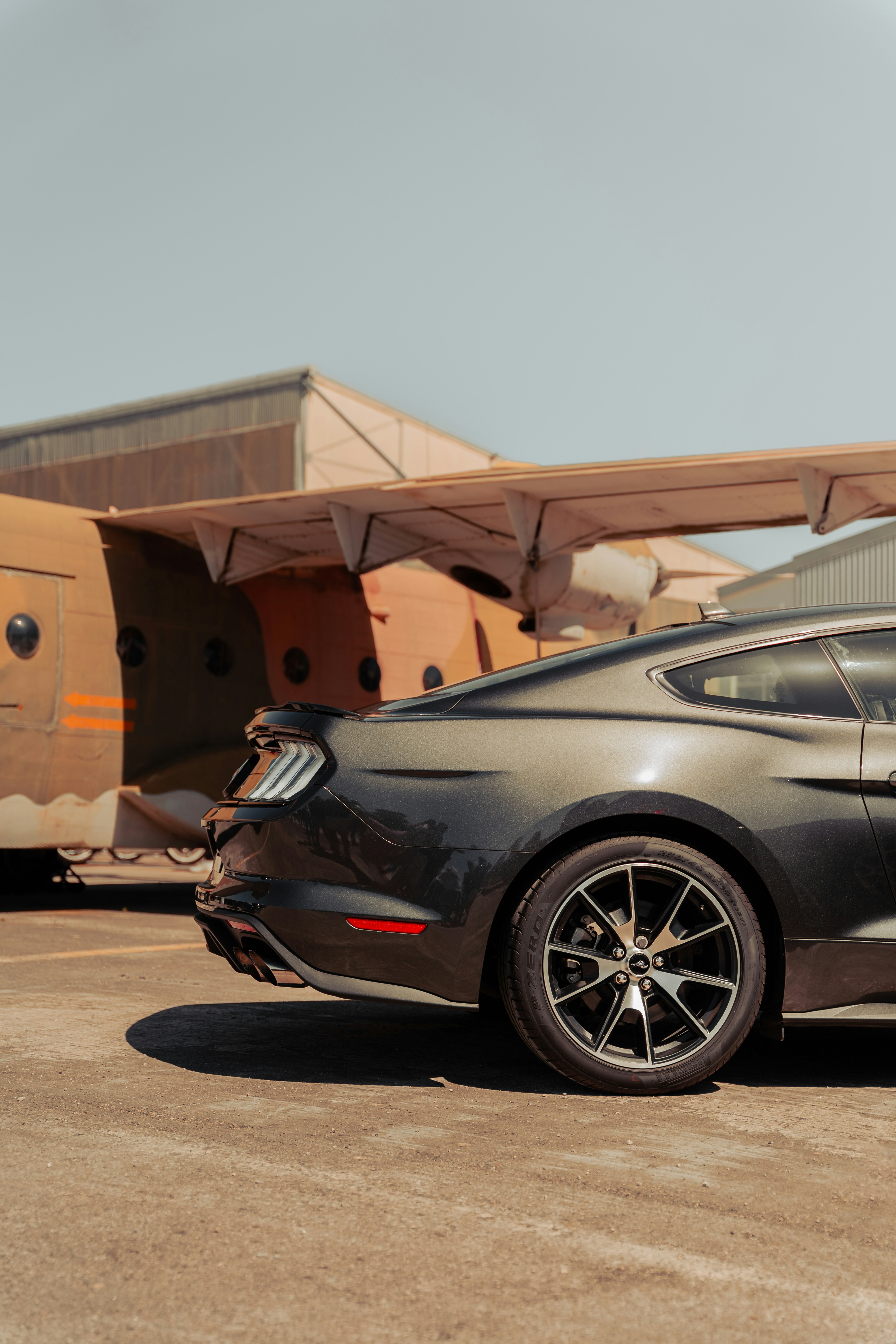 Midnight Gray Ford Mustang at an Airfield Hangar