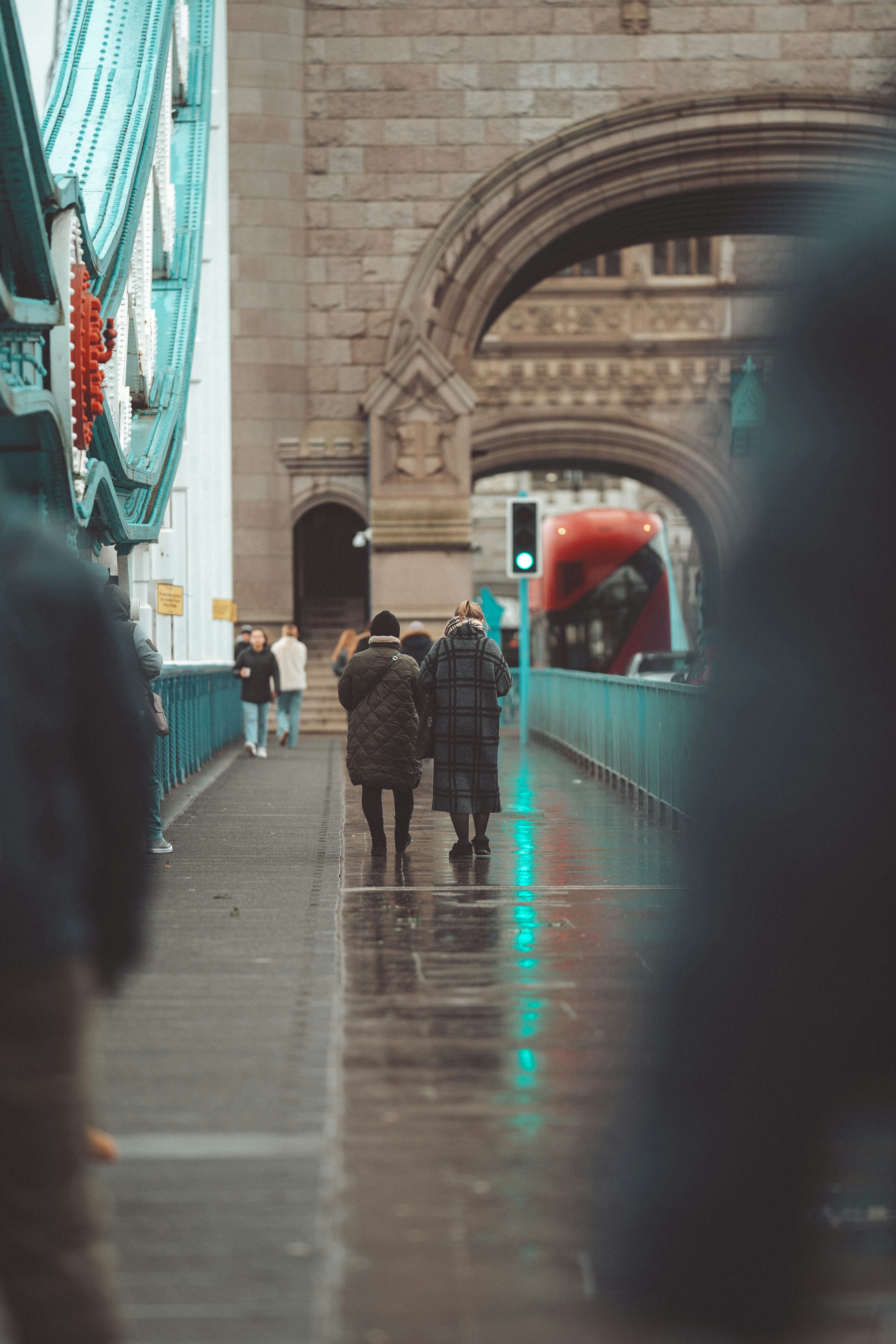 A group of people walking across a bridge photo – Free Human Image on ...