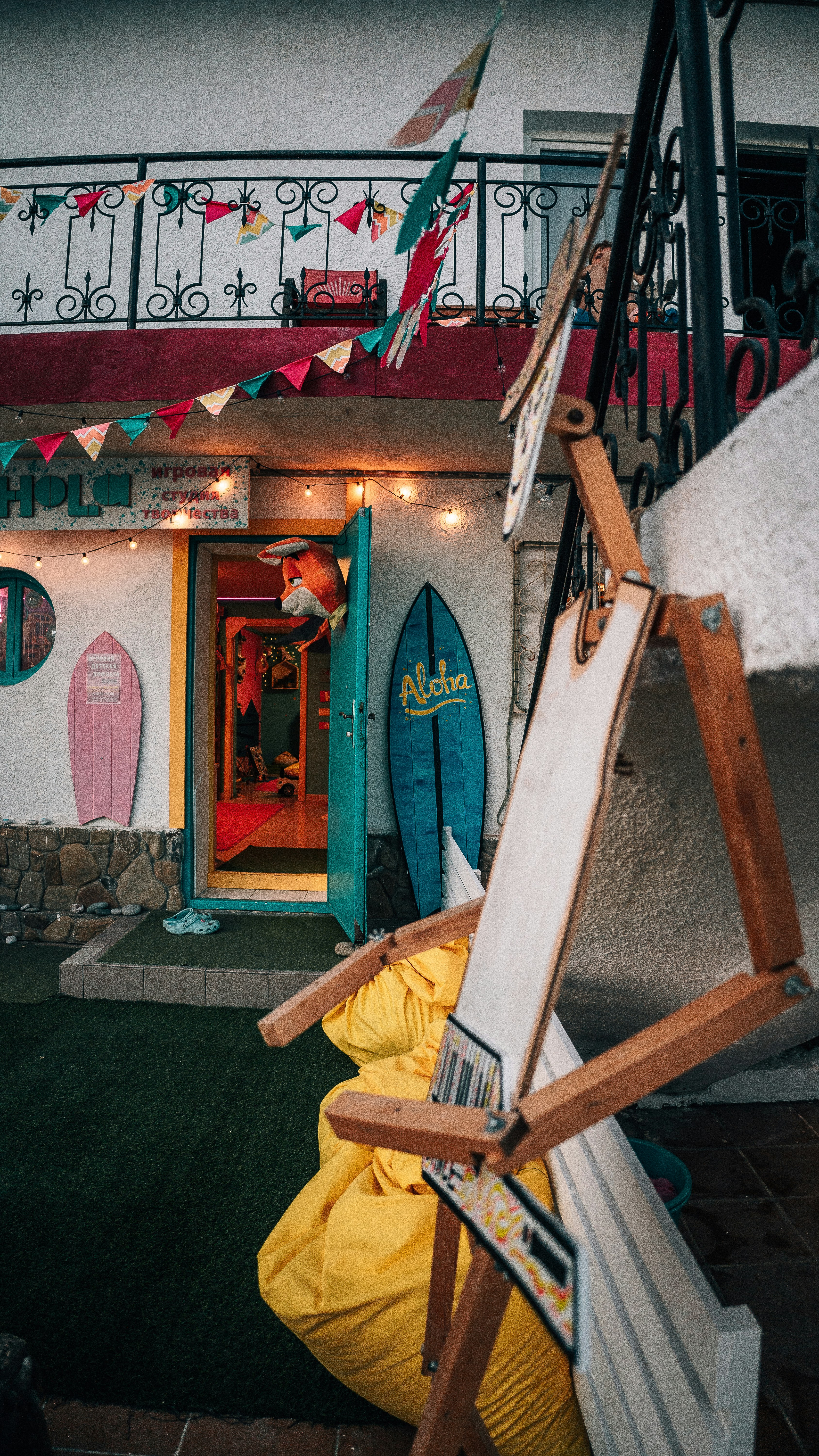 A surfboard leaning up against a building photo – Free Portrait Image ...