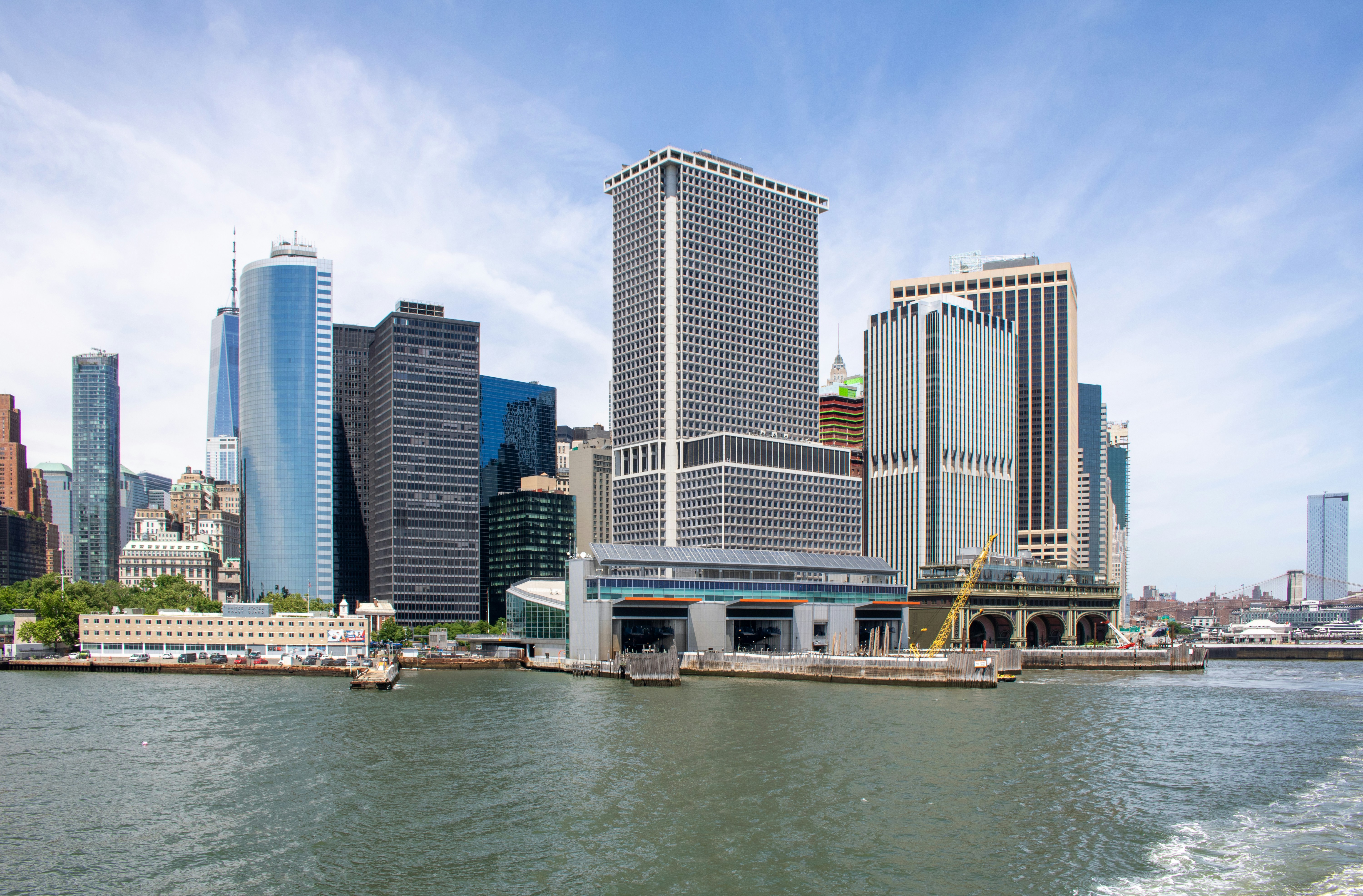 Pictured here is the view of Lower Manhattan that features the Staten Island Ferry Terminal, Battery Maritime Building, Justin Brown Plaza, and New York Plaza in it's skyline.