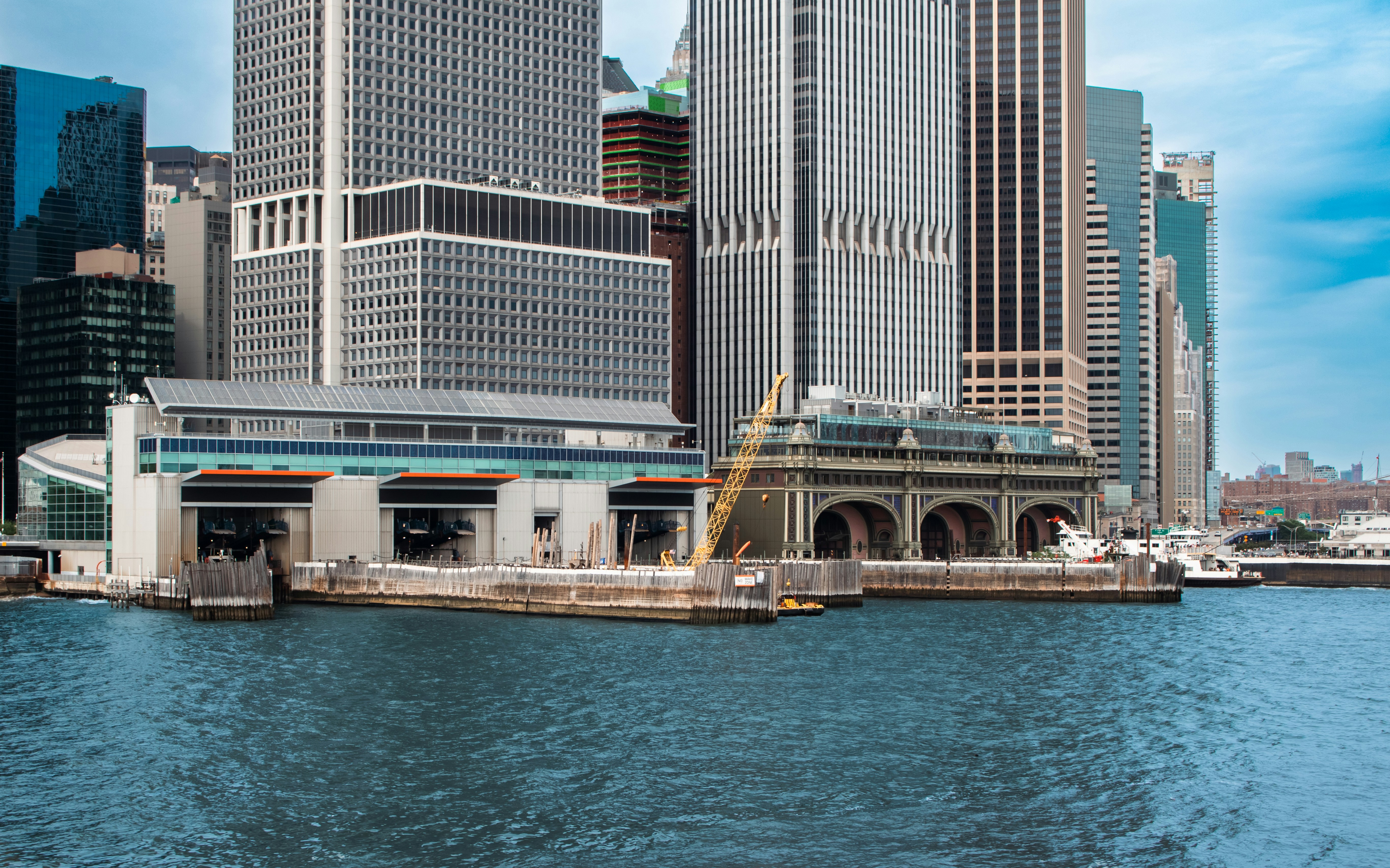 A large body of water in front of tall buildings photo – Free South ...