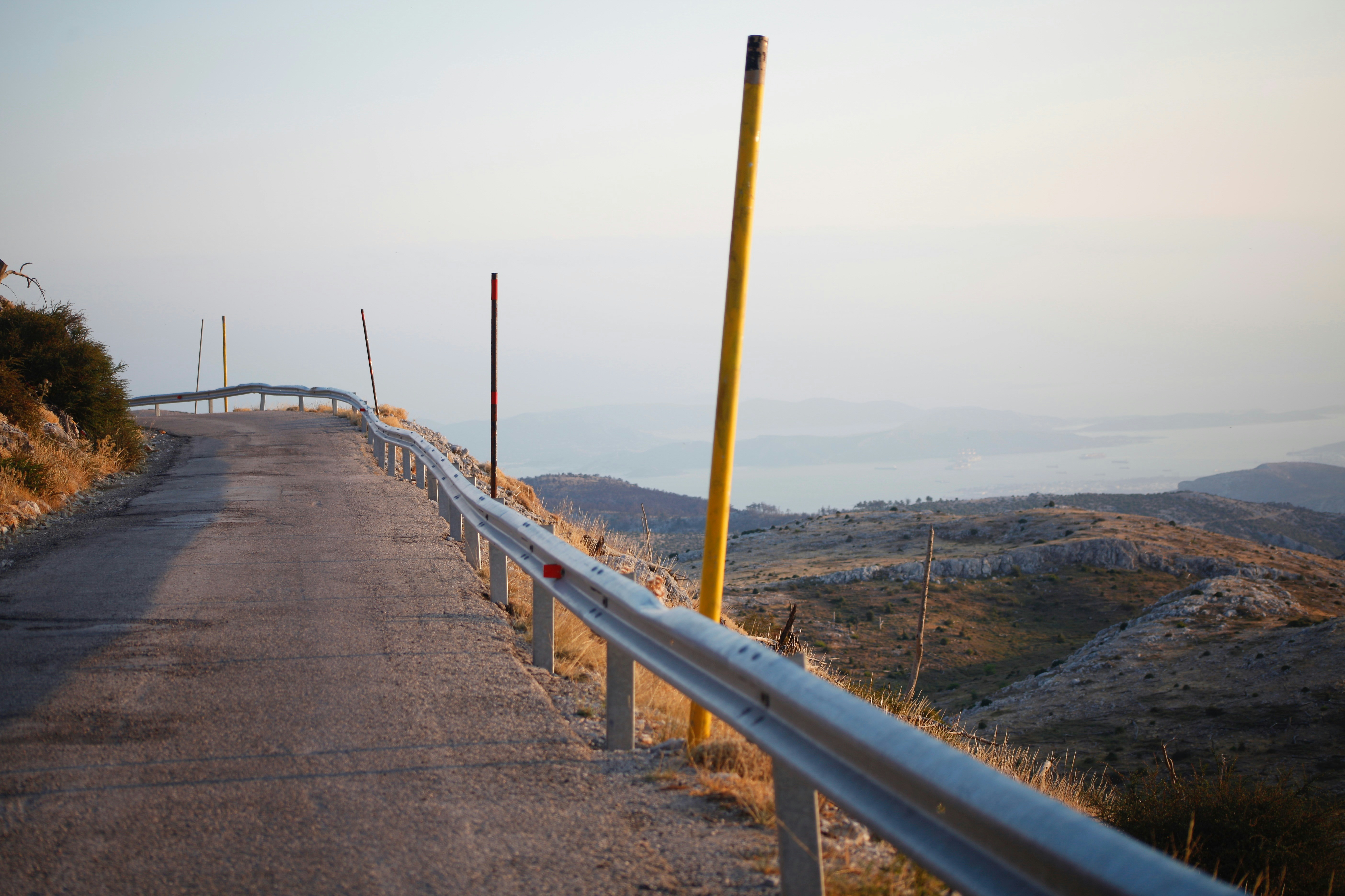 Sunlit Guard Rail Ascent Toward the Sea