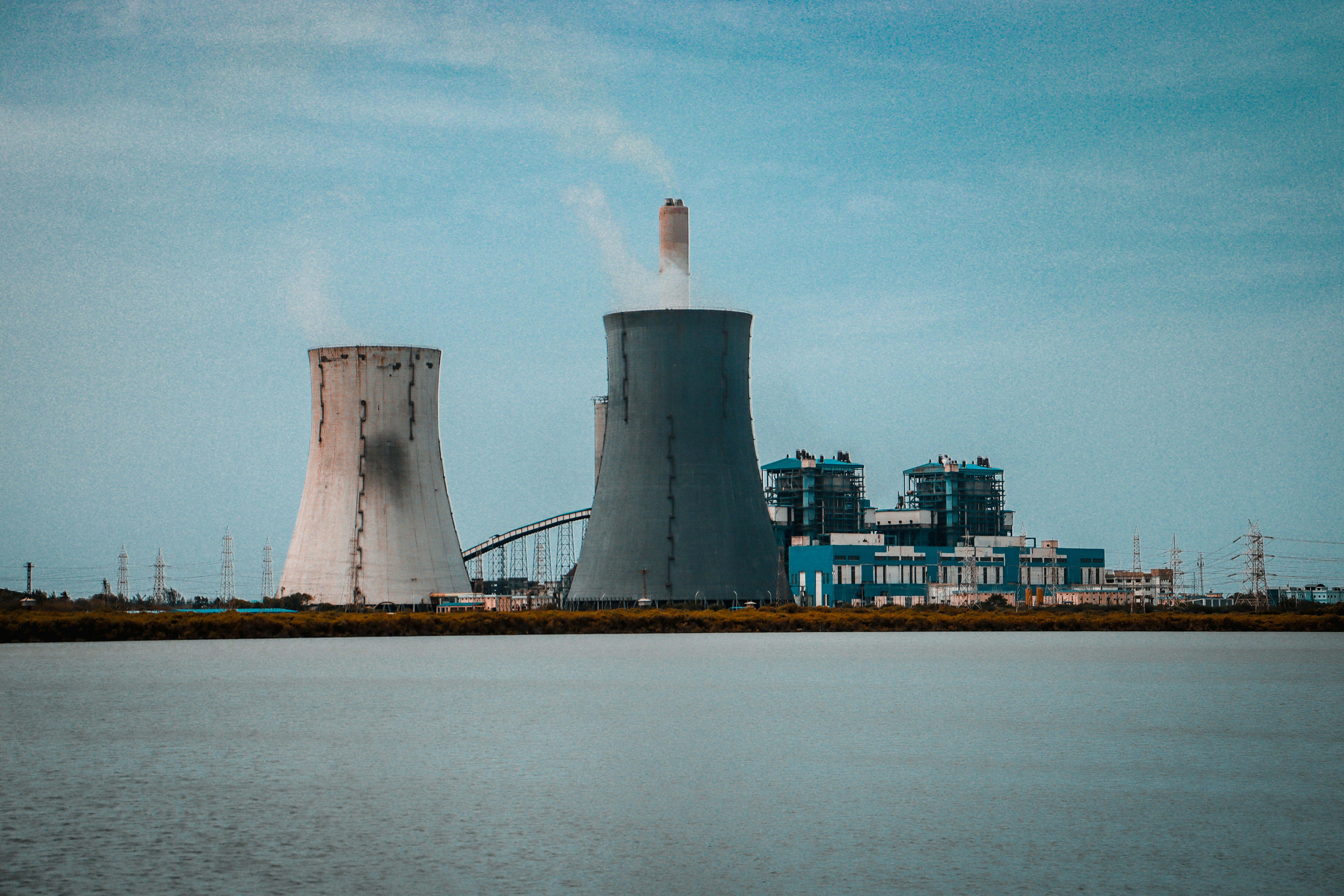 A nuclear power plant near a body of water photo – Free Urban Image on ...