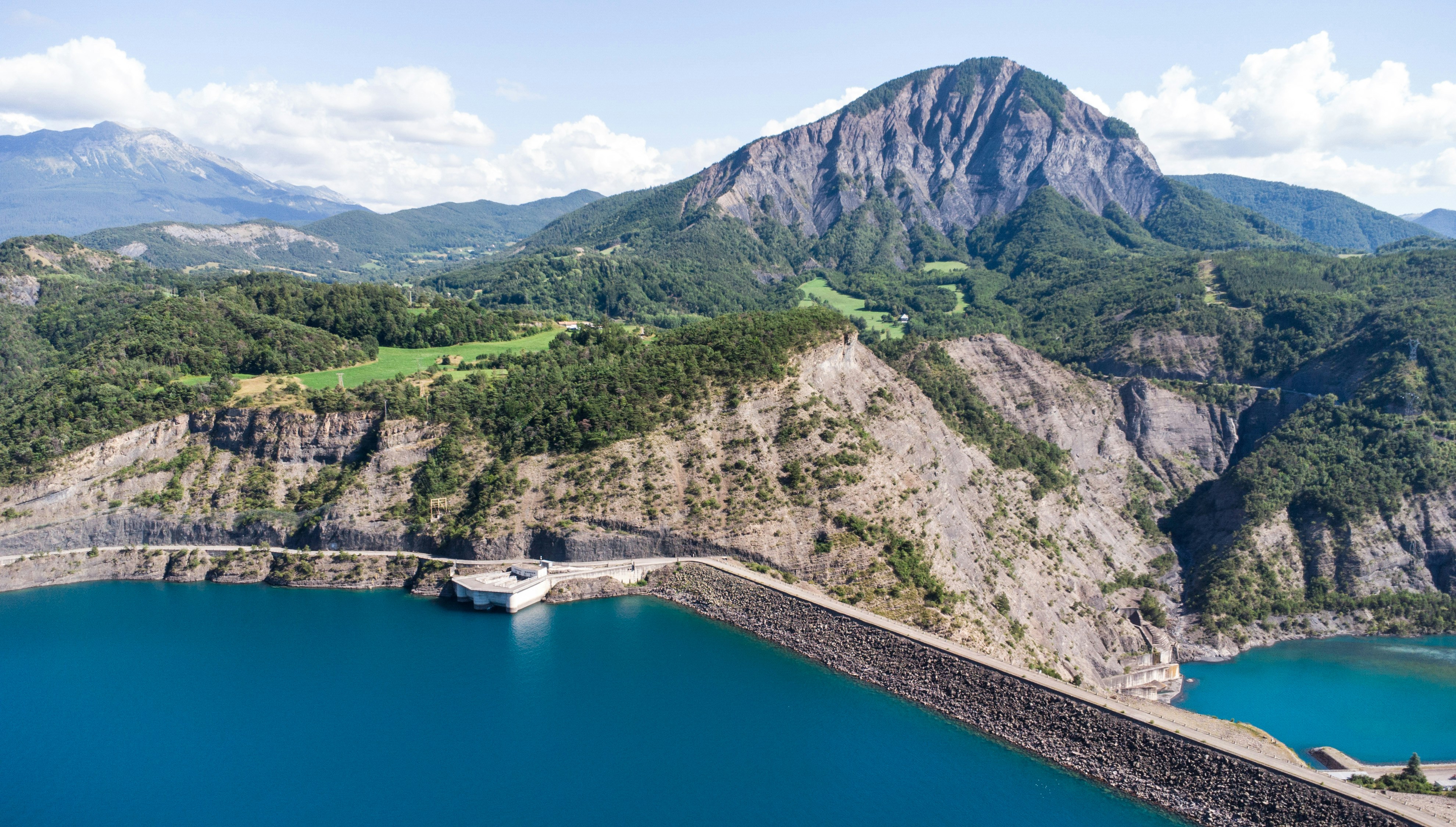 A large body of water surrounded by mountainsLucas Gallone